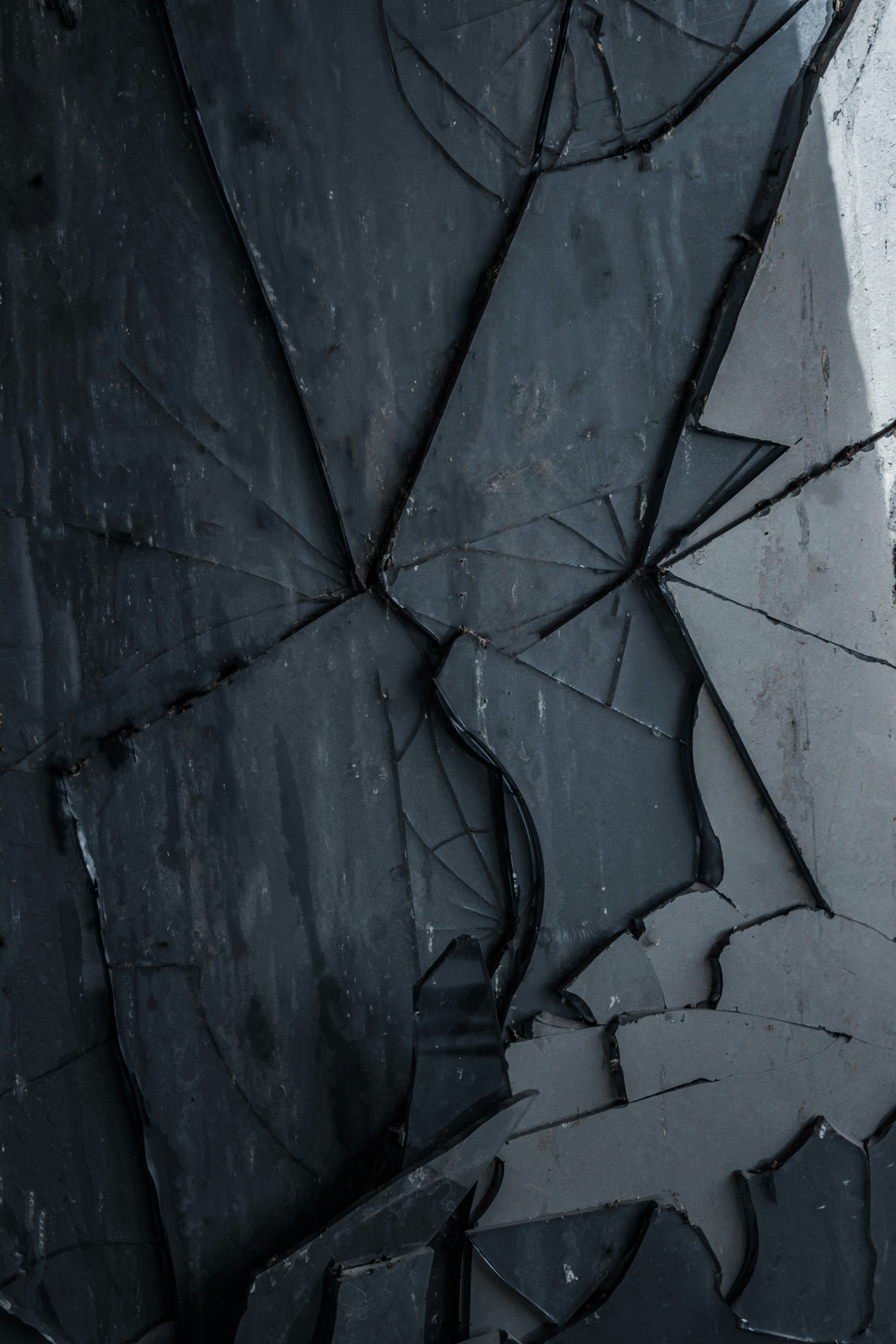 Cracked Midnight Mosaic: Close-Up of a Dark Surface