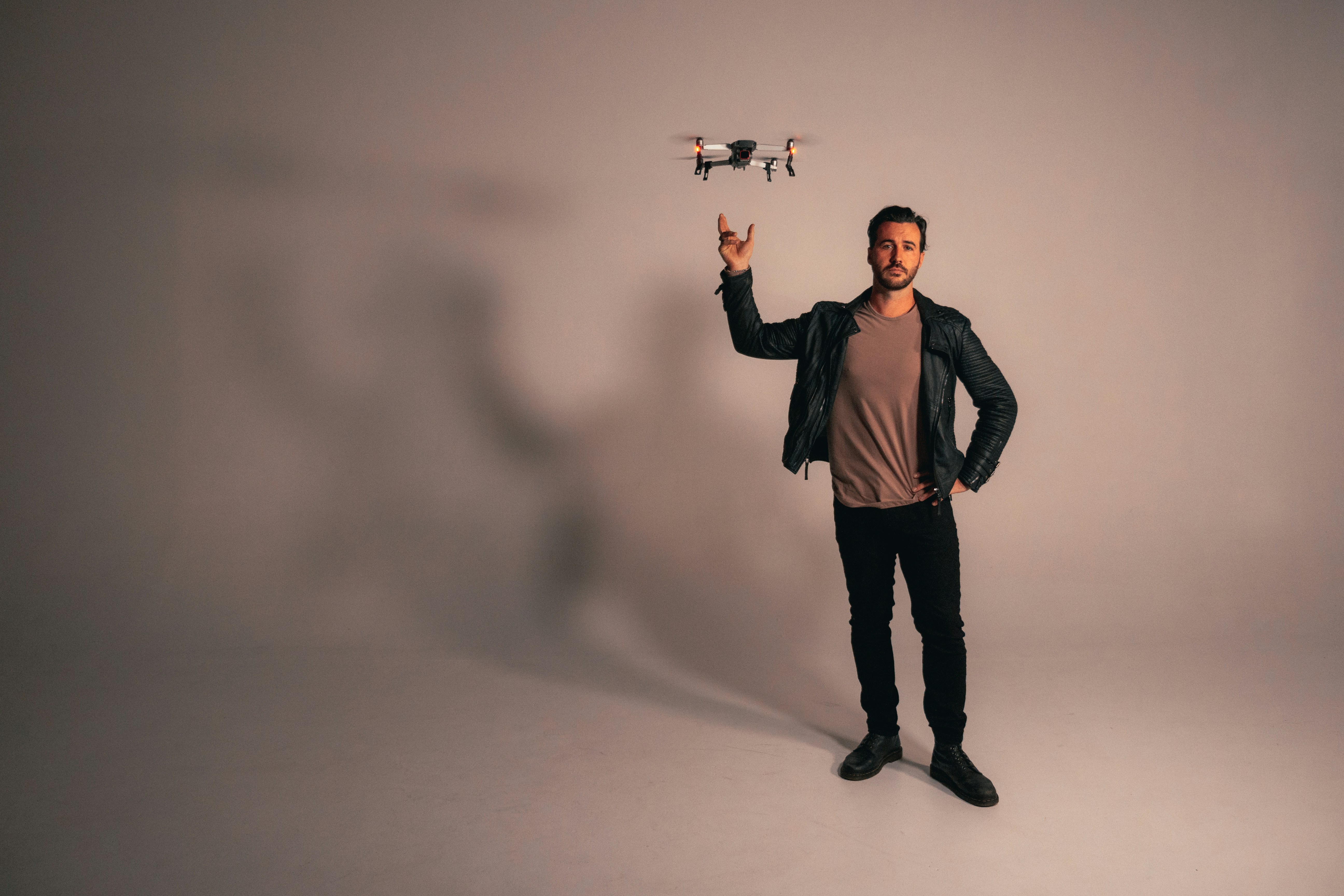 Studio Portrait with a Hovering Drone: Man and Machine in Quiet Light