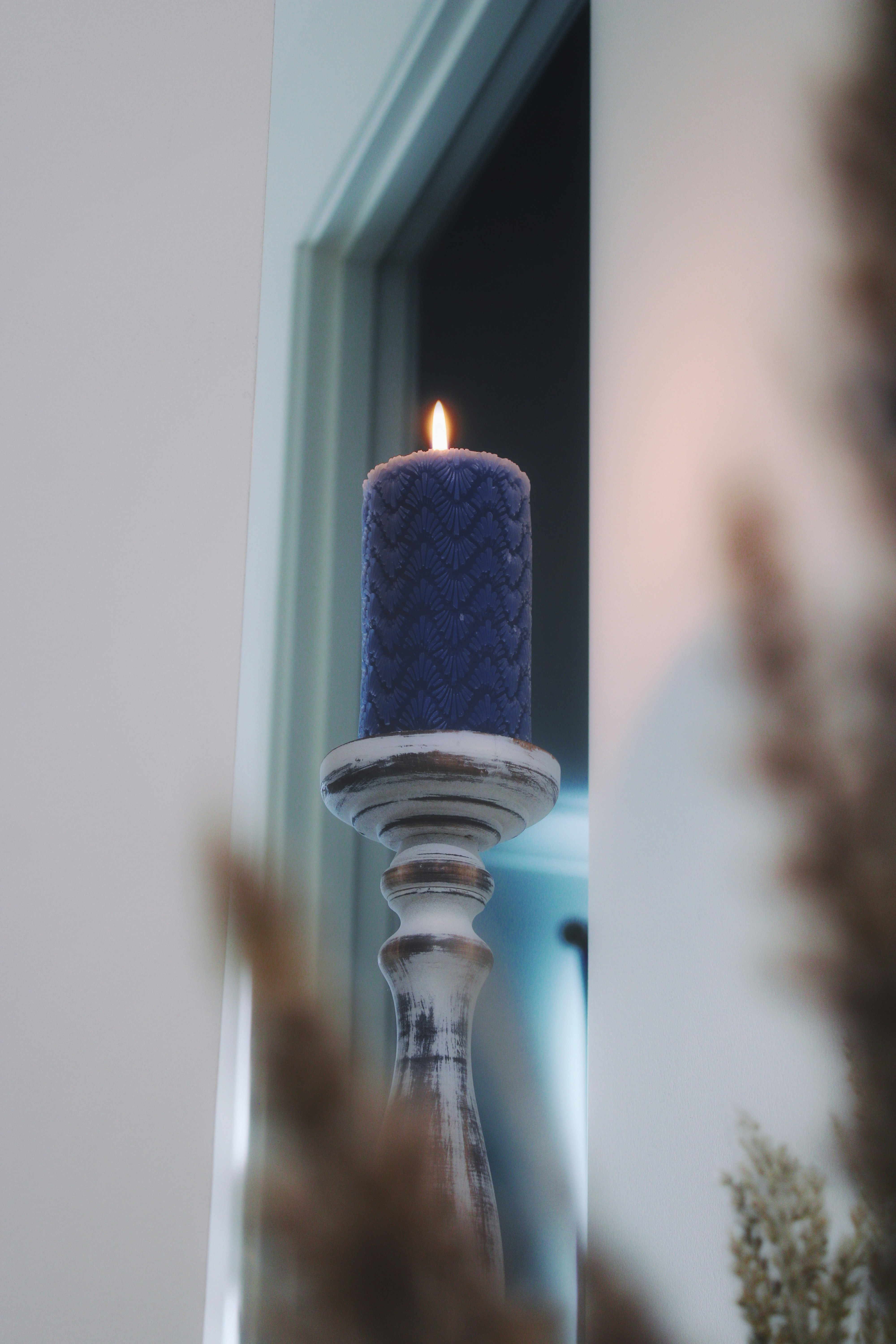Candle in a Narrow Window: A Blue Flame Stands Tall