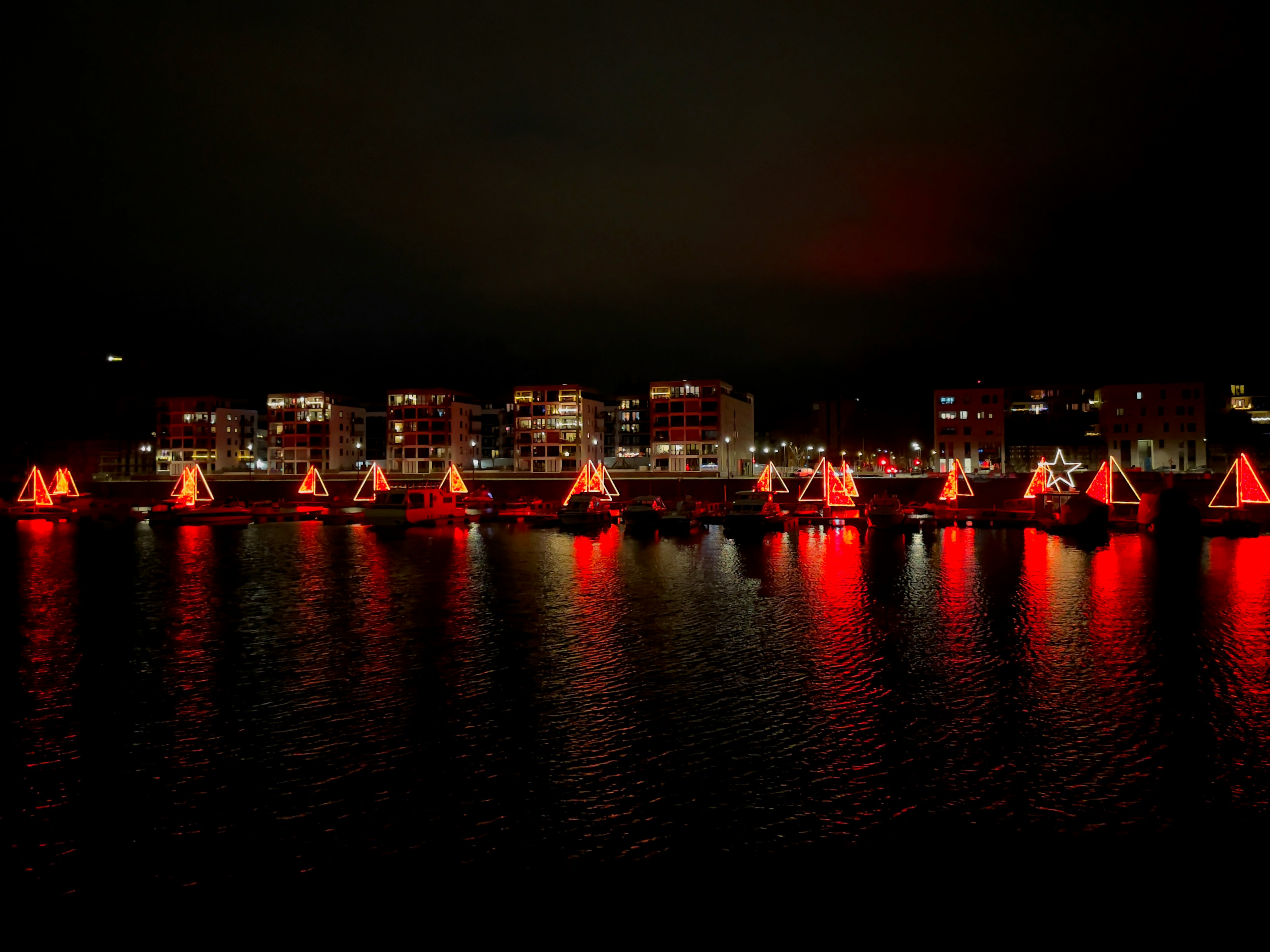 Luminous Fleet on a Midnight Harbor