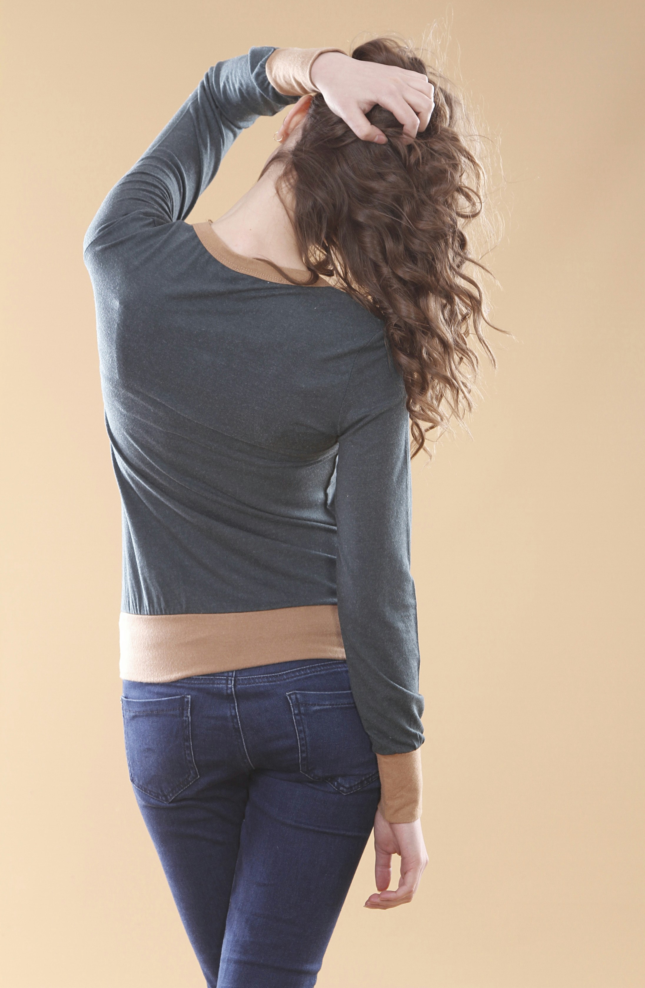 Untied Waves: Back View of Teal Knit and Denim Under Quiet Studio Light