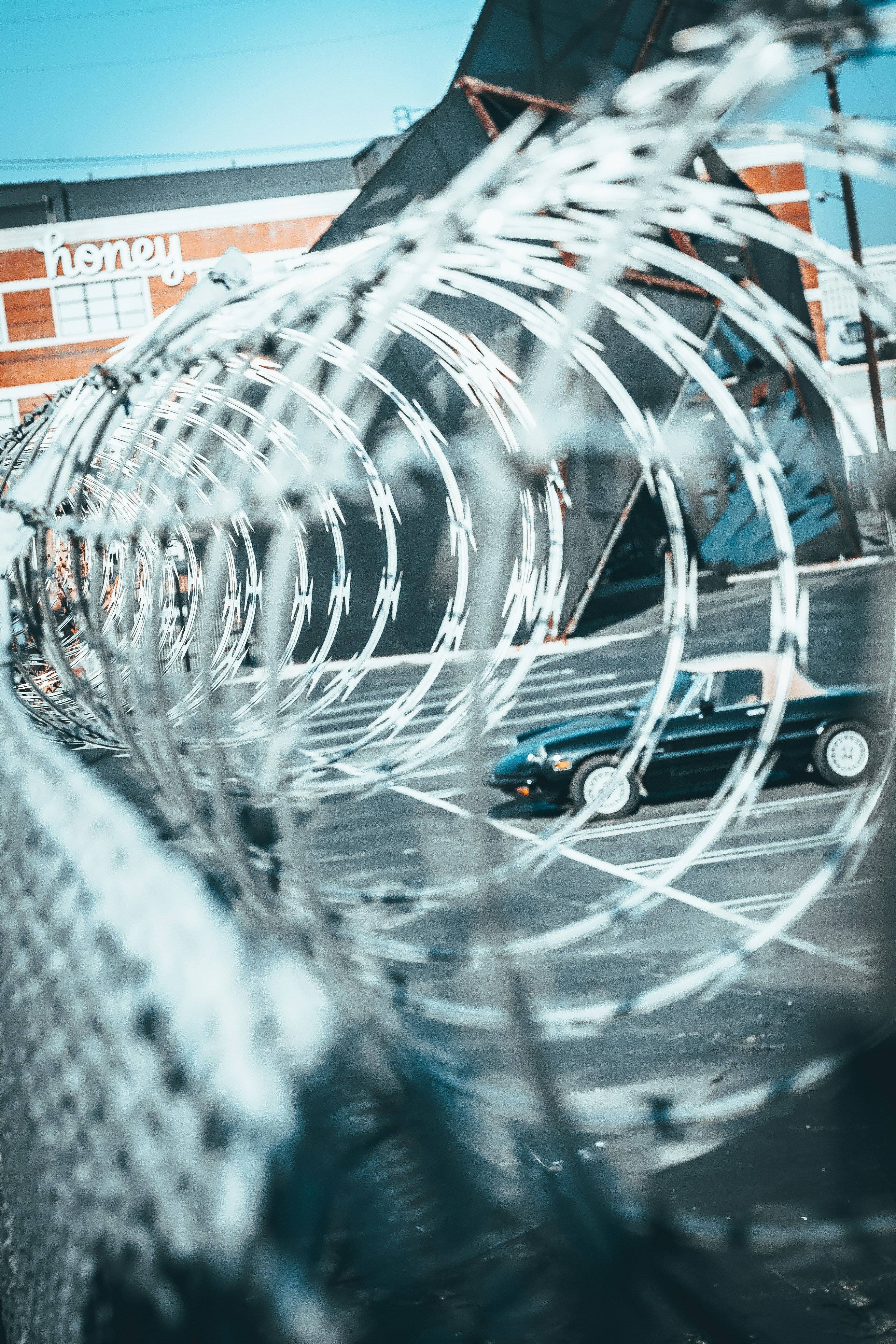 Spiral Barrier: The Loop Framing an Idle Urban Moment