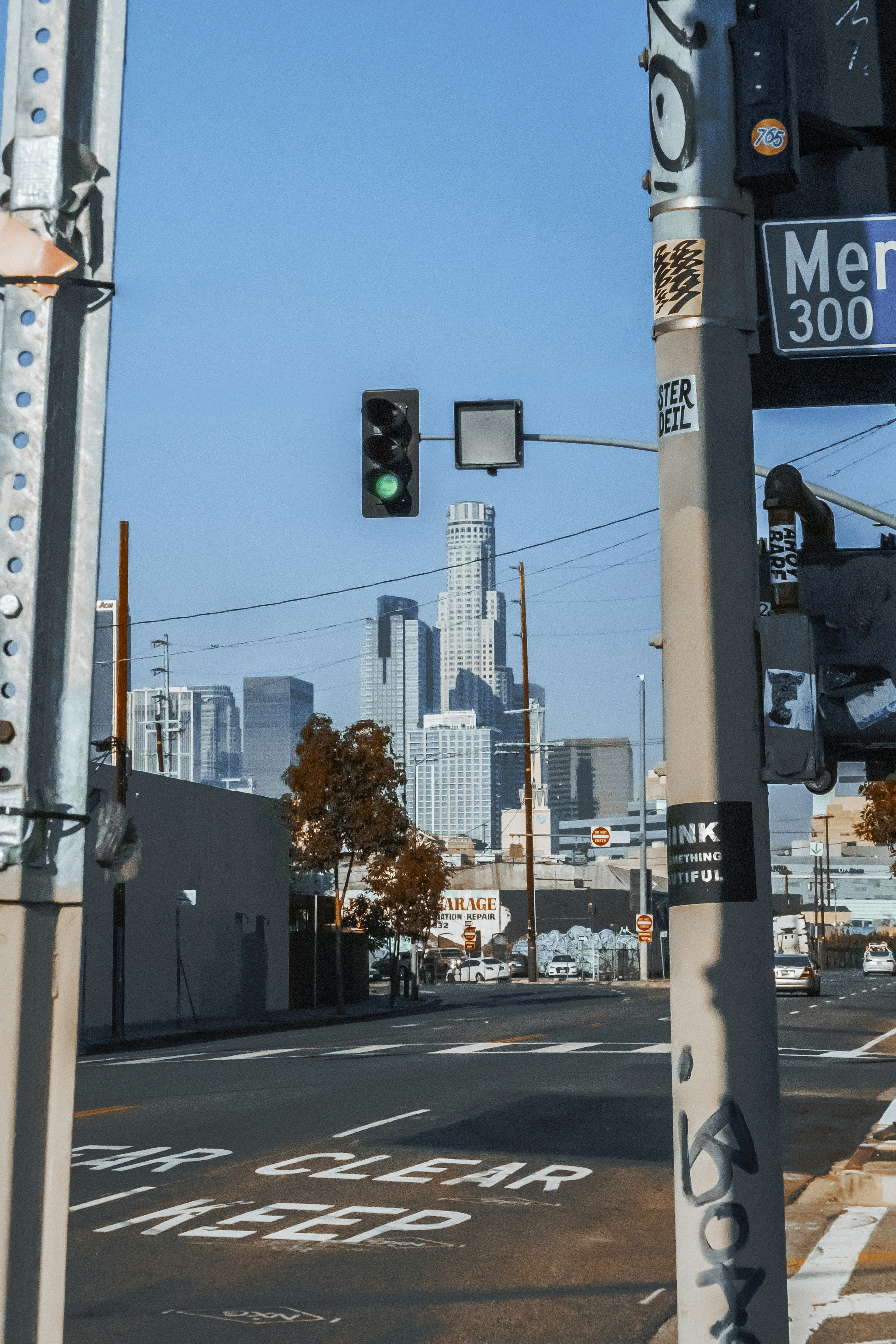 Green Light at the Edge: A Street-Level View Toward a Rising Skyline