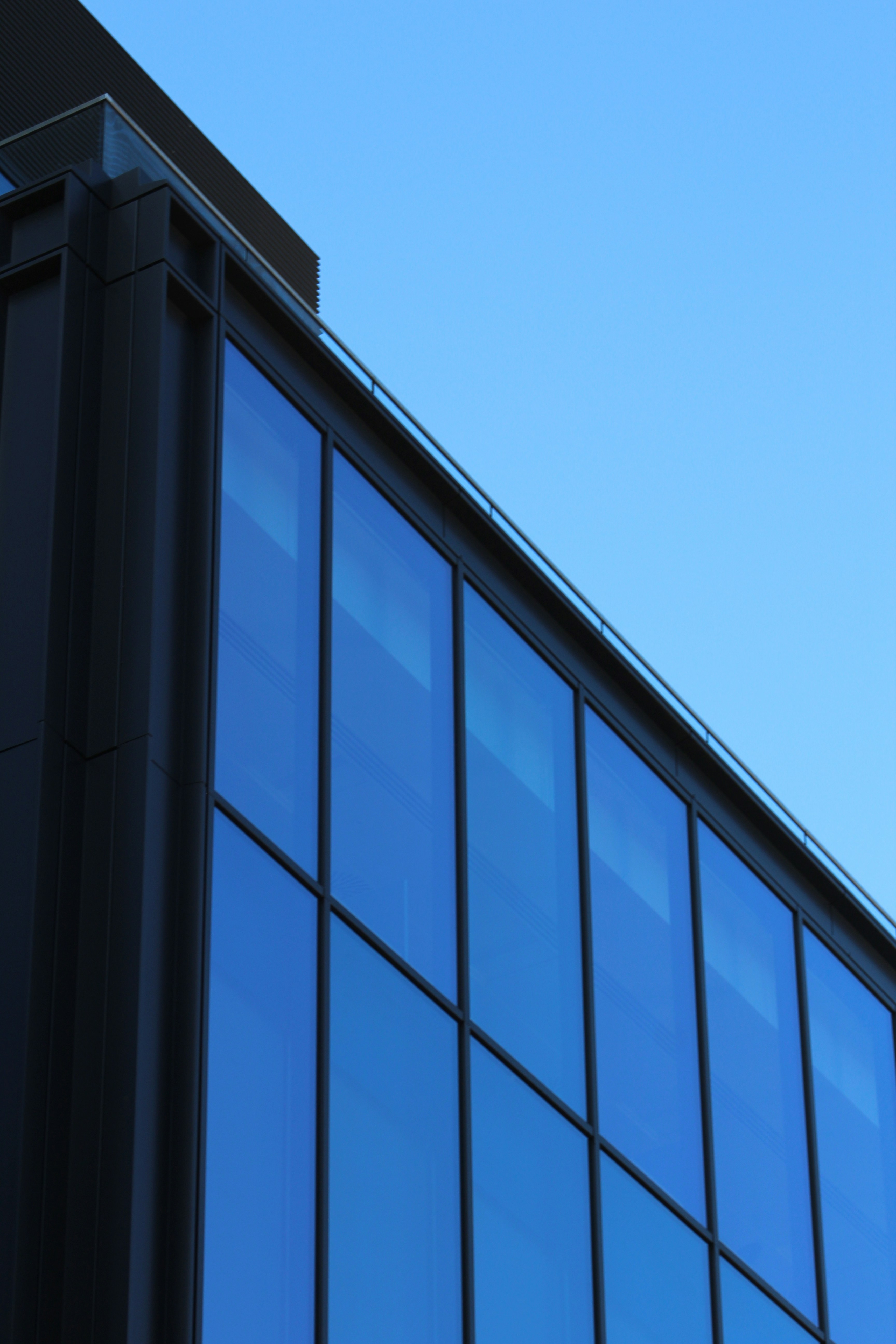 Black glass window building under blue sky during daytime photo – Free ...