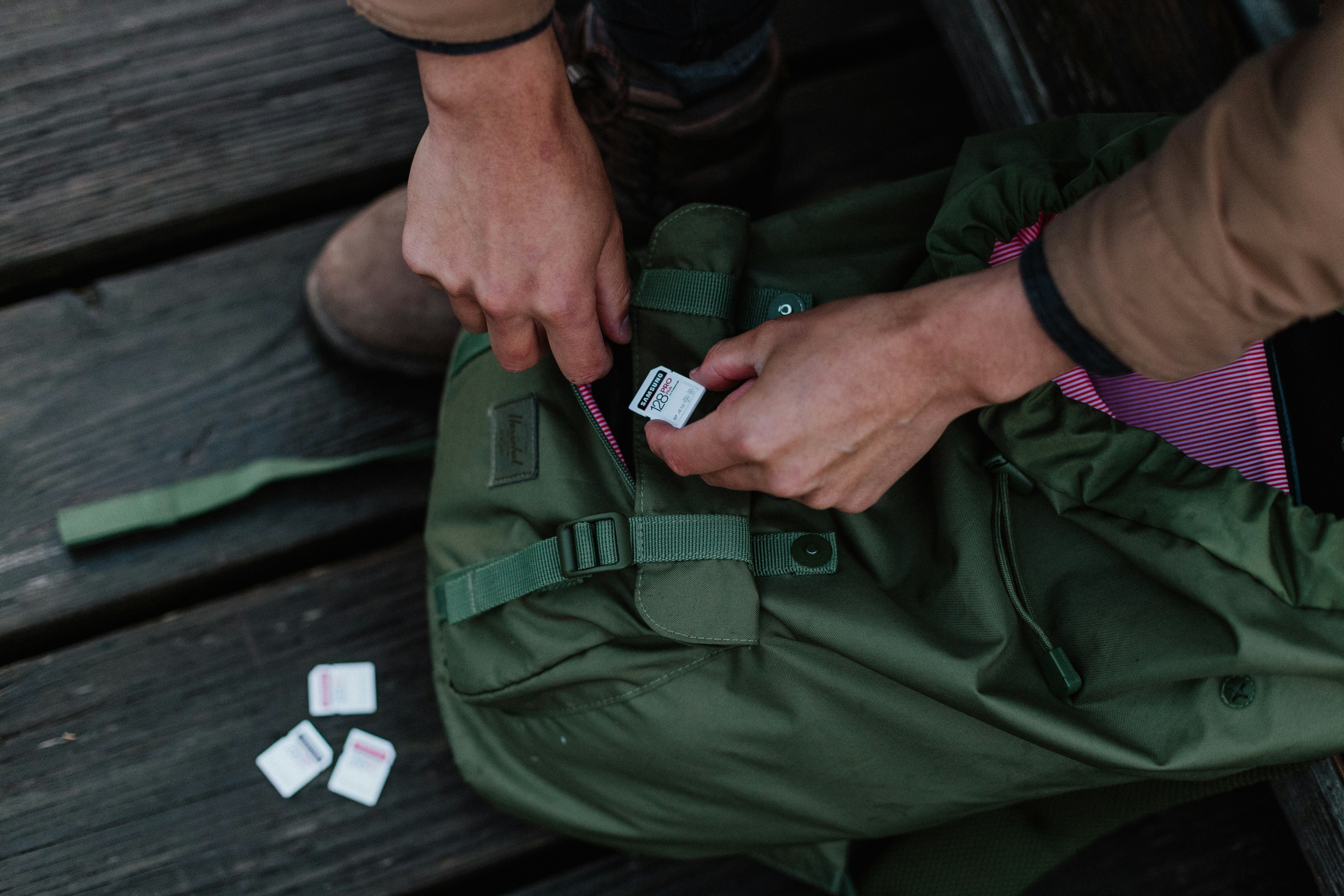 Hands at Work: Unsealing the Backpack in Quiet Focus