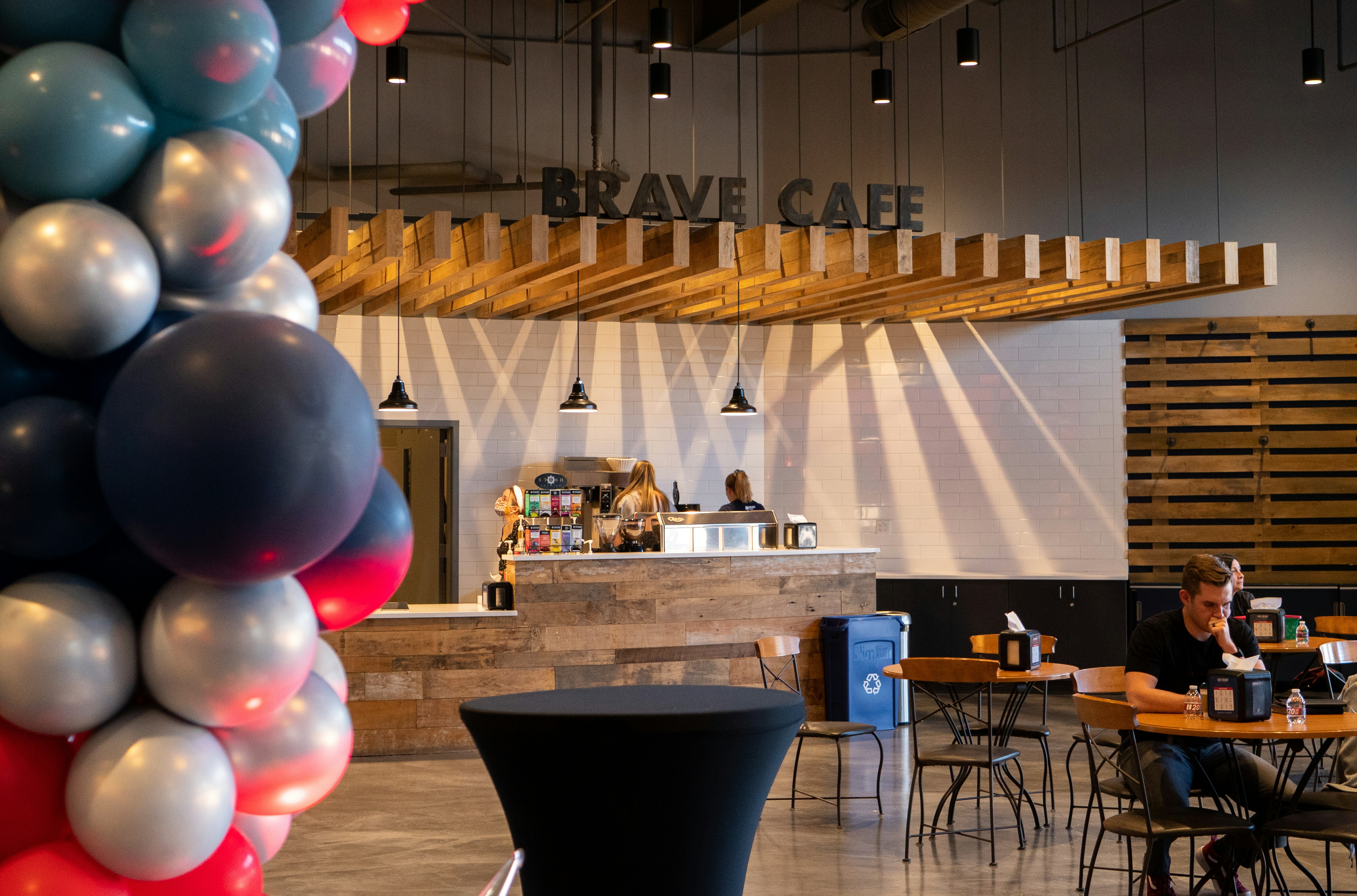 Balloon Arch Framing the Quiet Counter at Brave Café