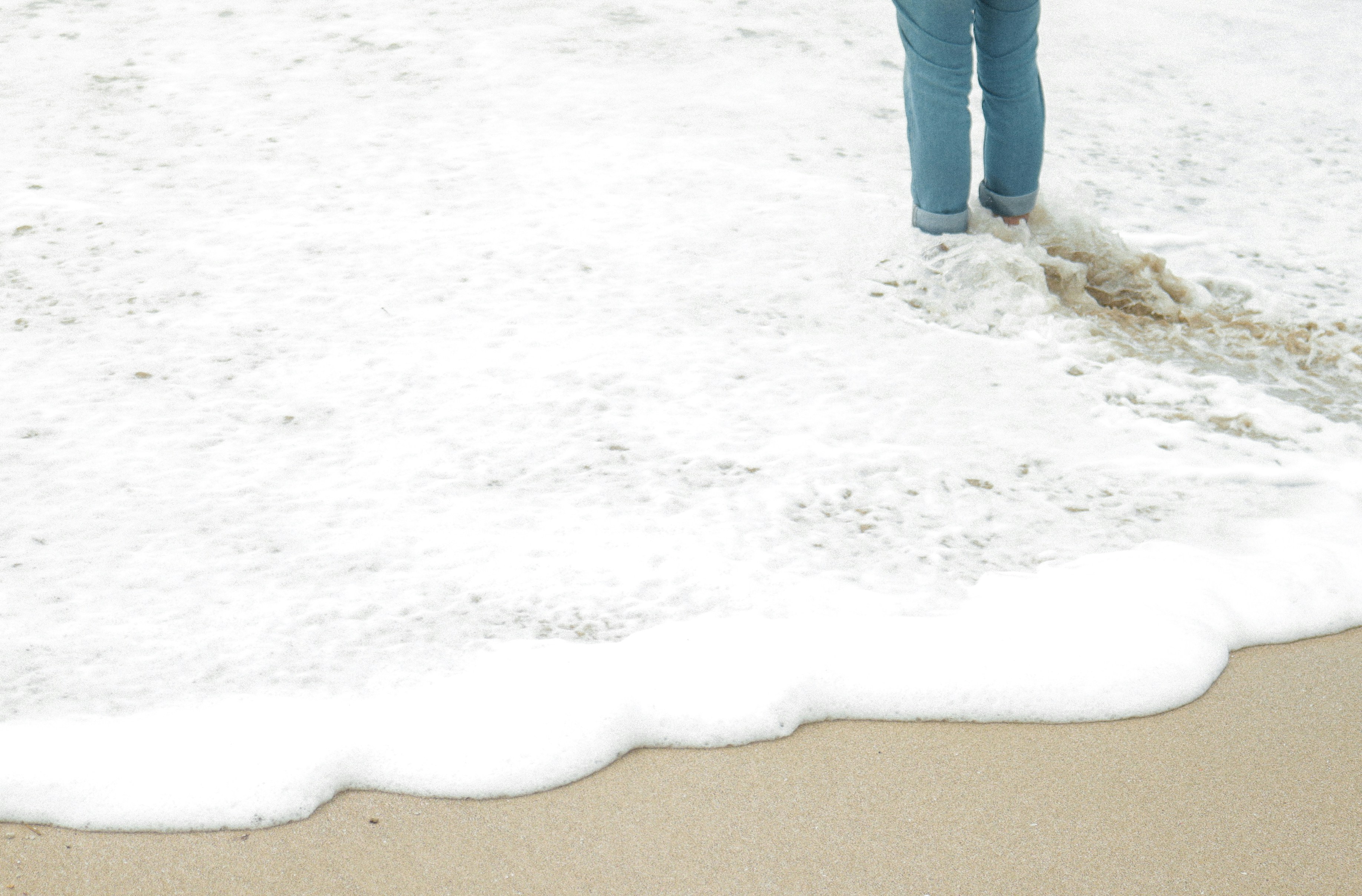 Footsteps into Foam: A Beach Walk Halting at the Tide