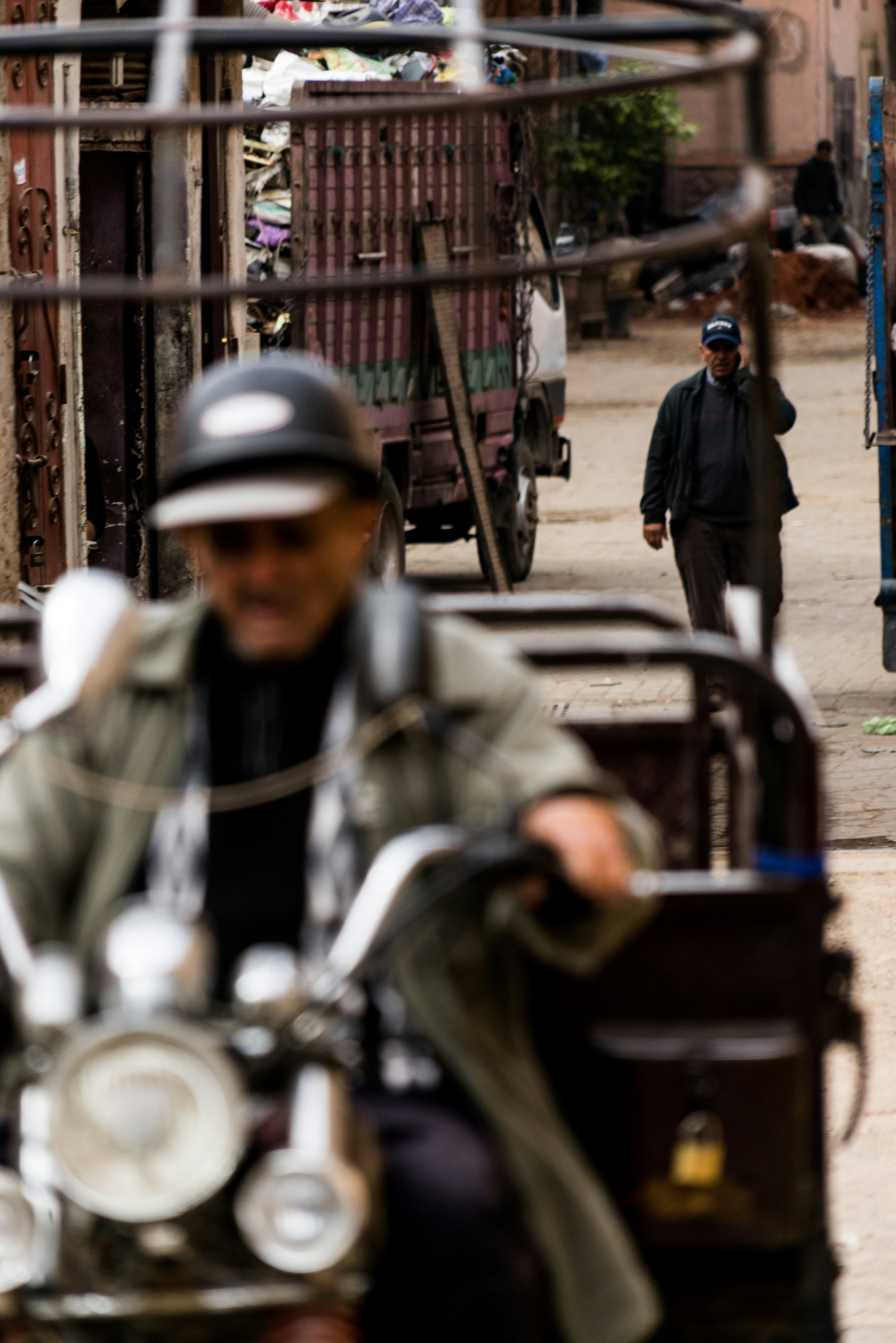 Blurred Rider, Distant Observer: A Street Portrait Through Motion