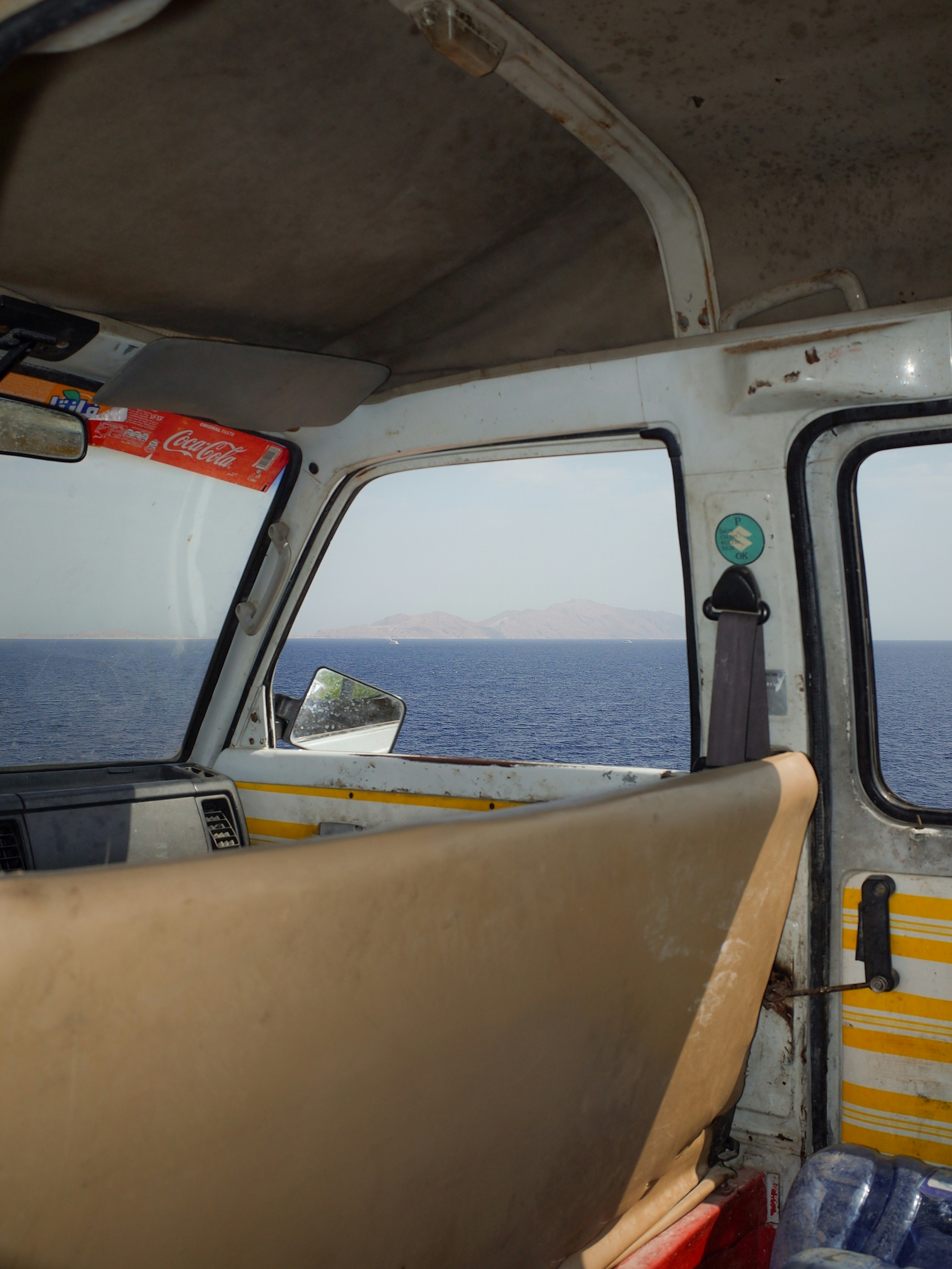 Horizon Through a Weathered Van Window