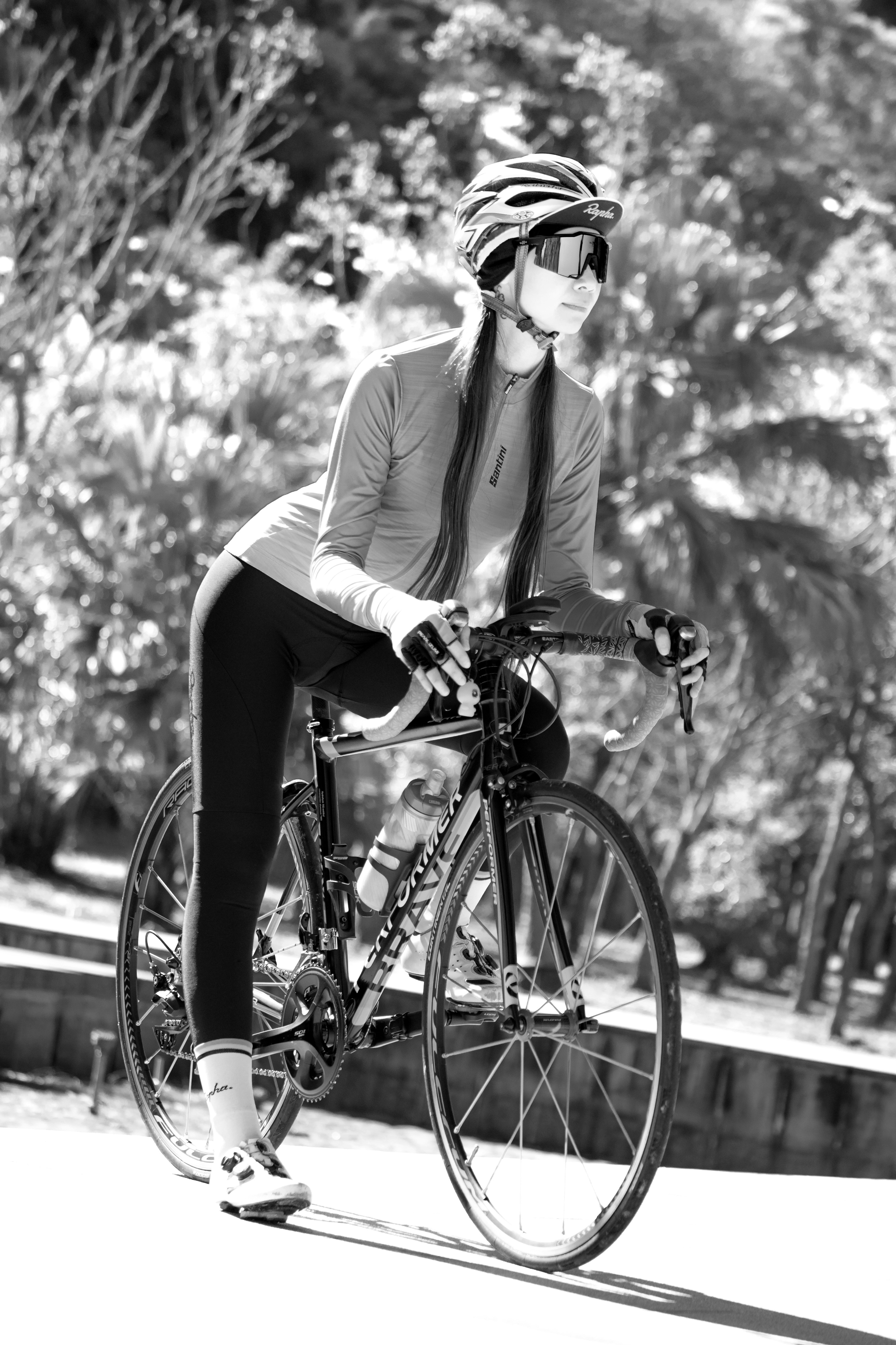 Chrome and Shadow: A Road Cyclist in a Sunlit Park