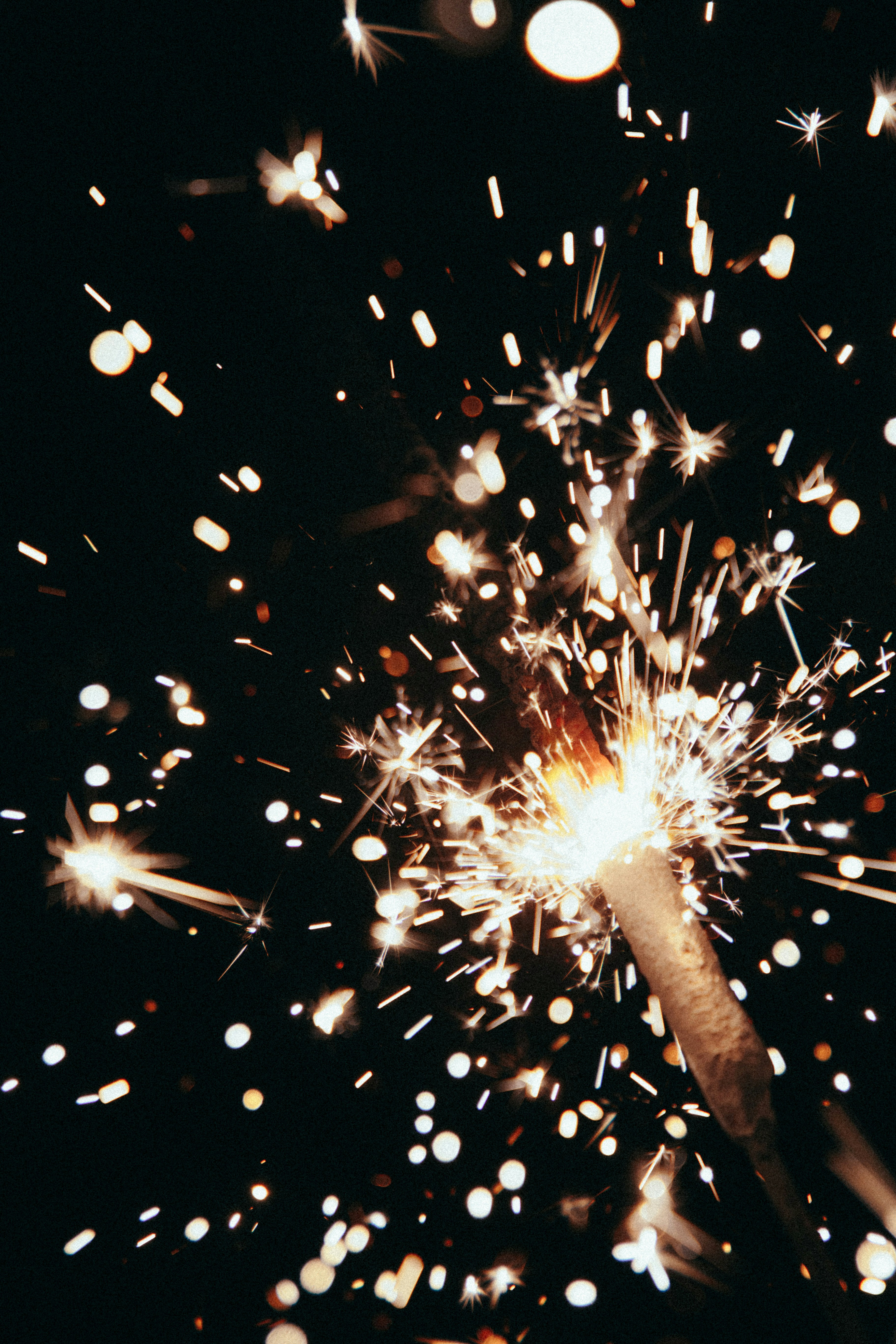 A close up of a sparkler on a black background photo – Free Sparkler ...