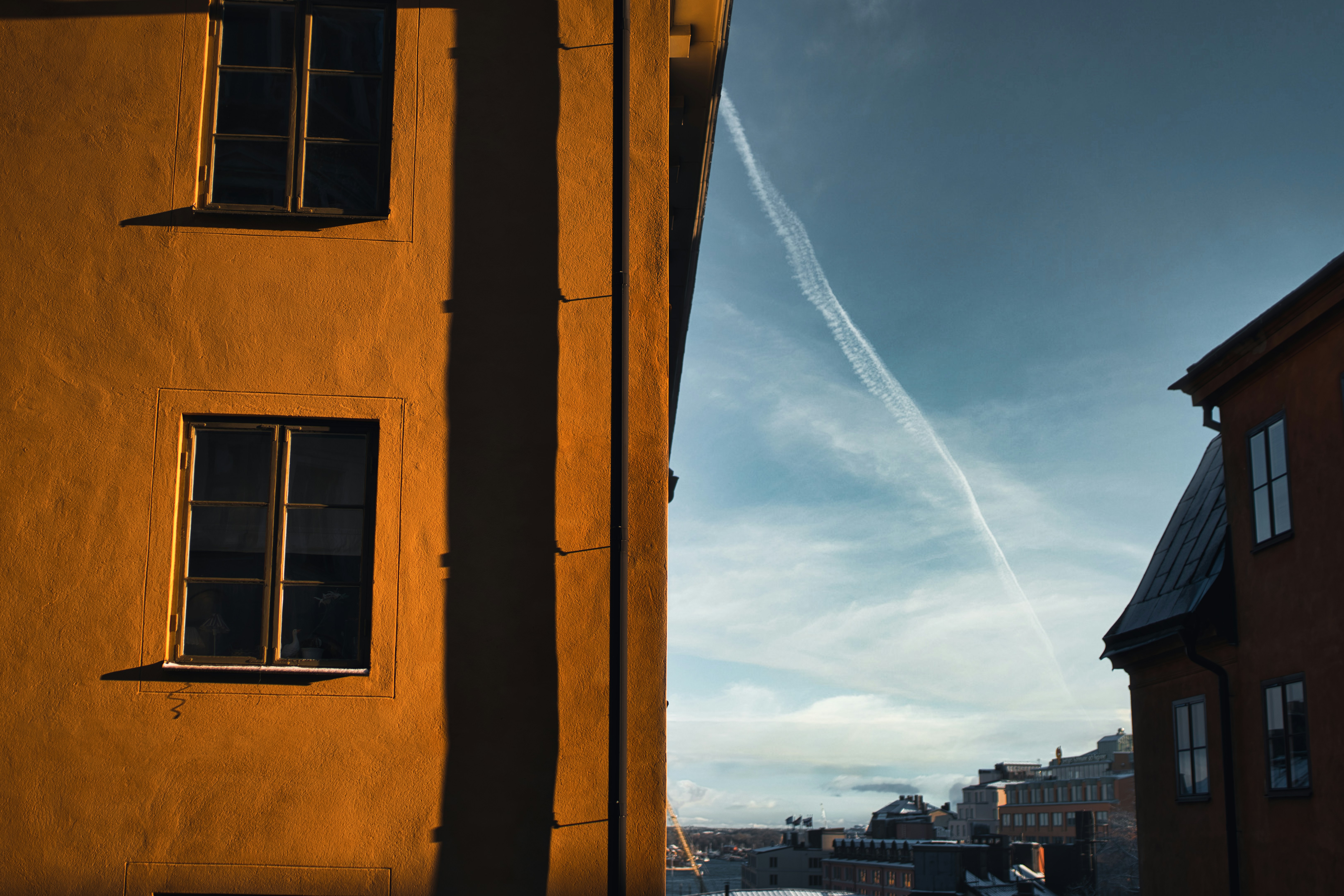 Golden Facades and Skyward Contrail