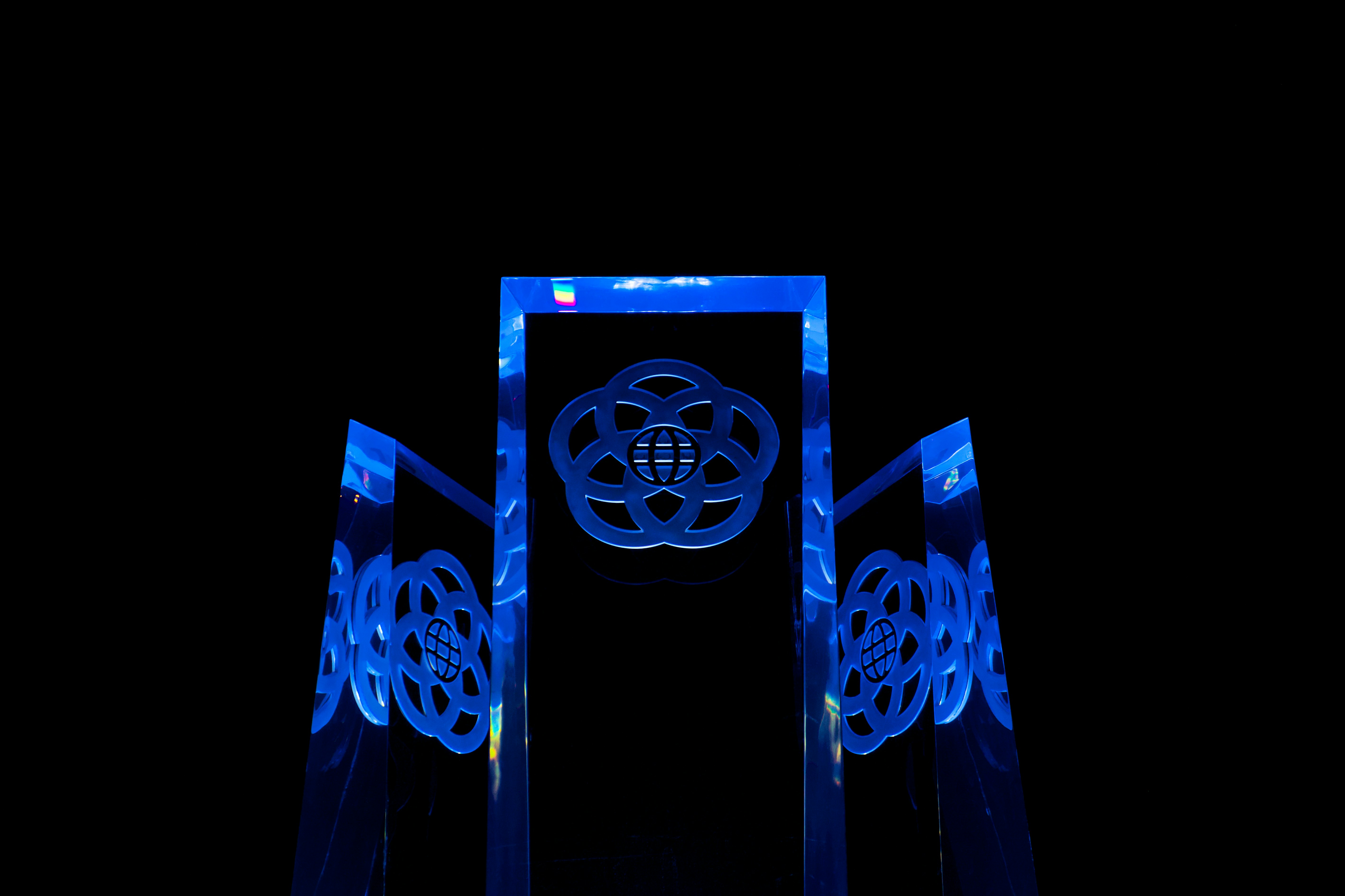 Midnight Portal: Azure Glass Archway Framed by Quiet Reflections