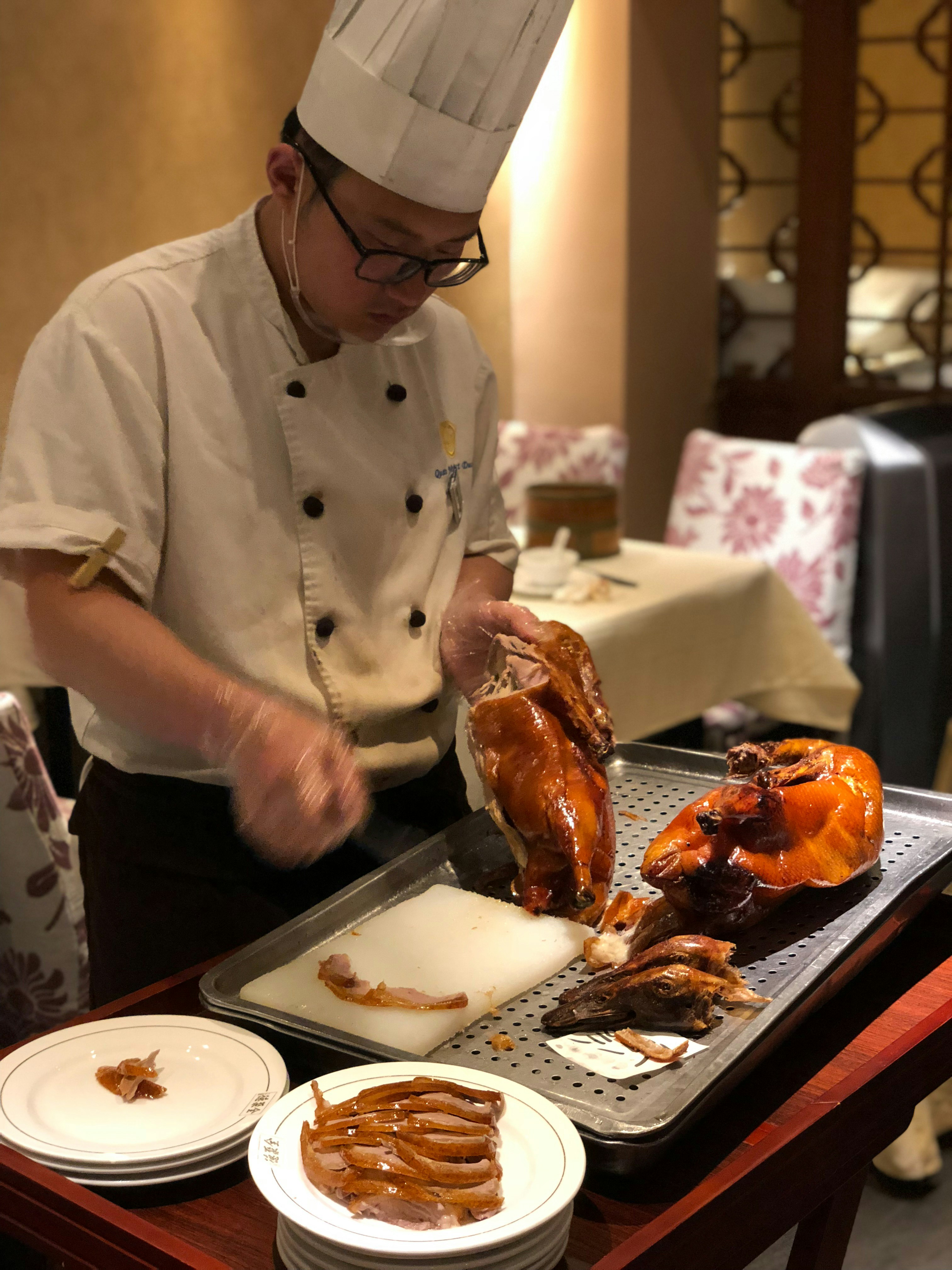 Man in white chef uniform holding a cooked chicken photo – Free Human ...
