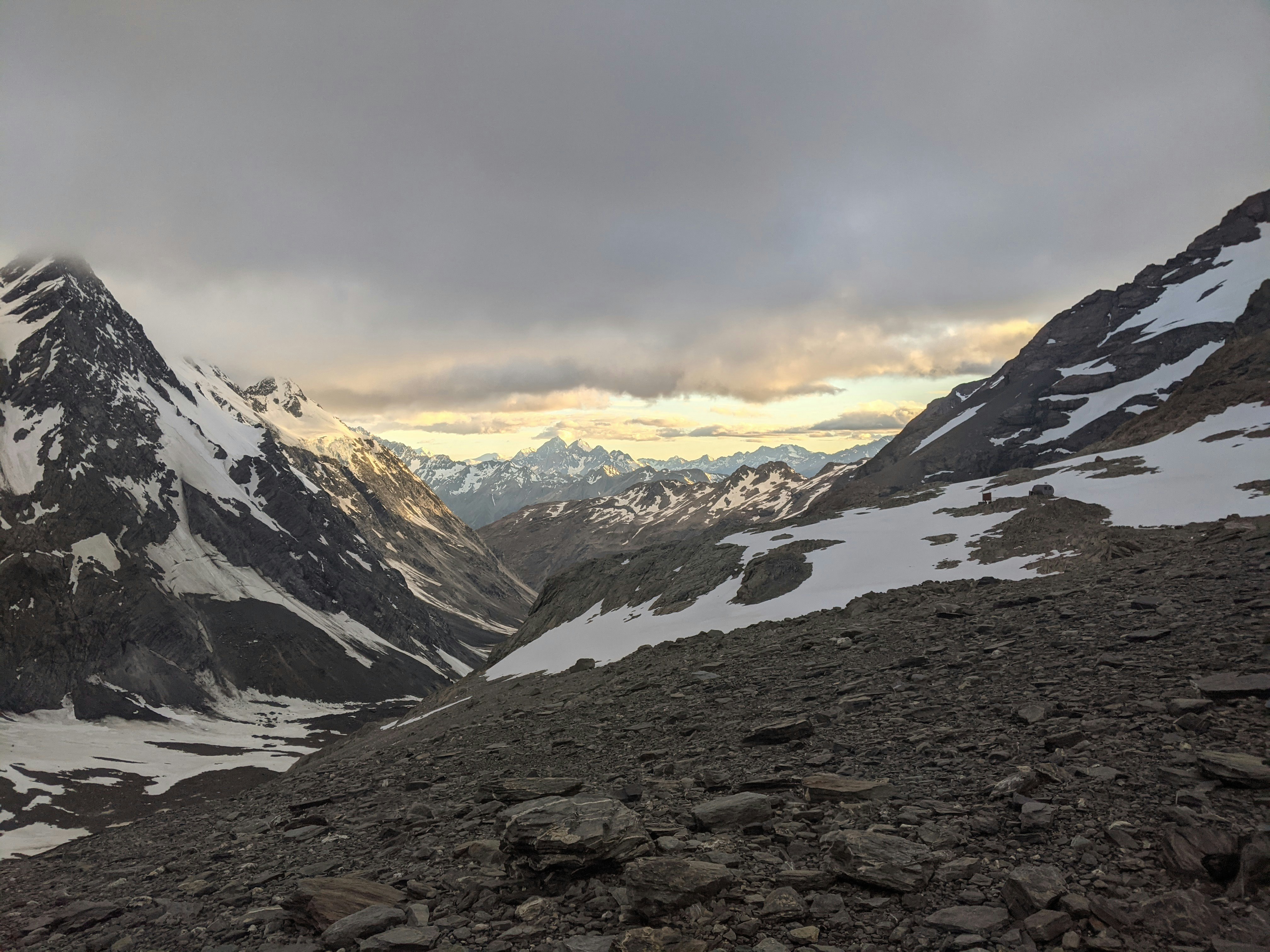 Snow covered mountain under cloudy sky during daytime photo – Free ...