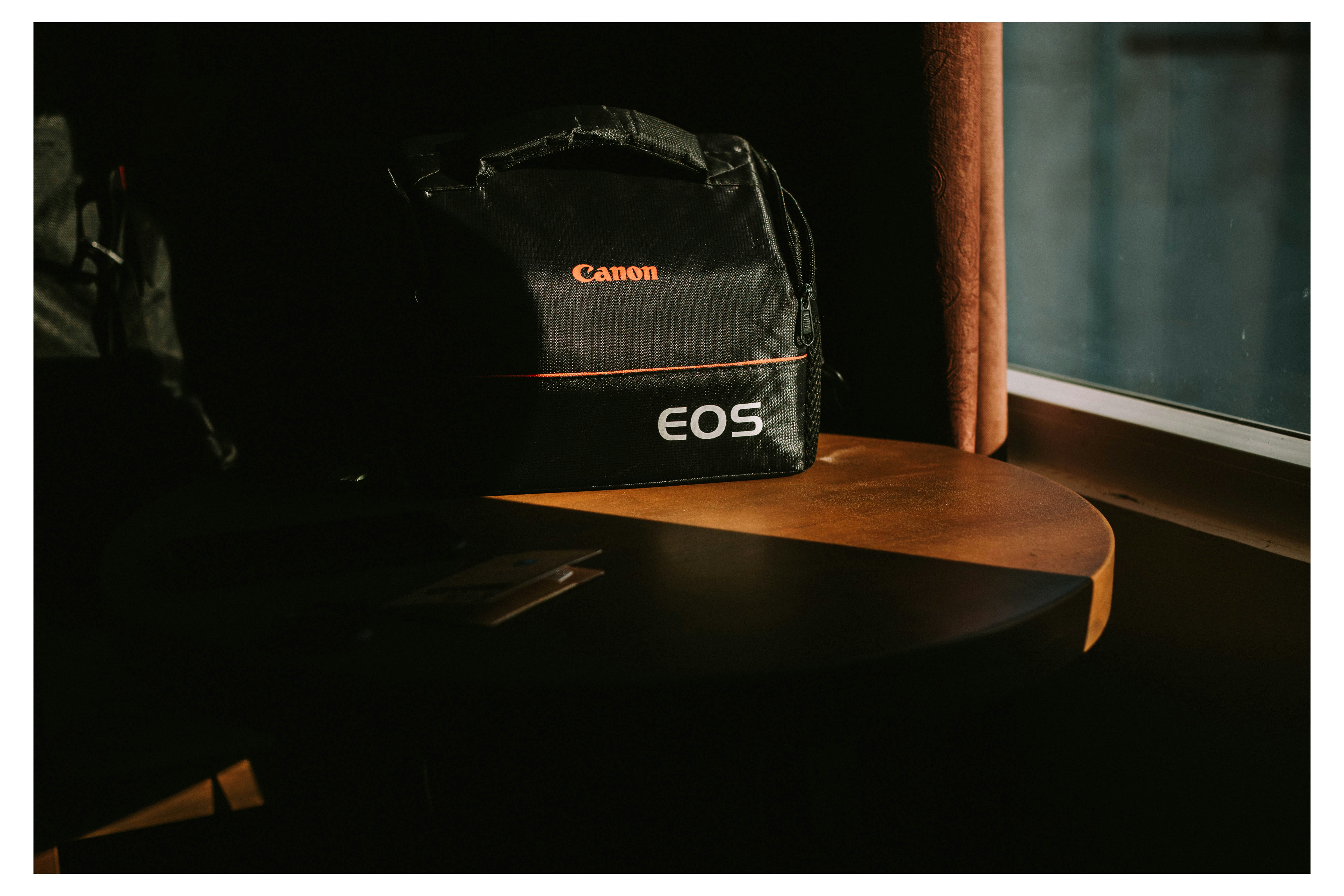 Black and red adidas backpack on brown wooden table photo – Free ...