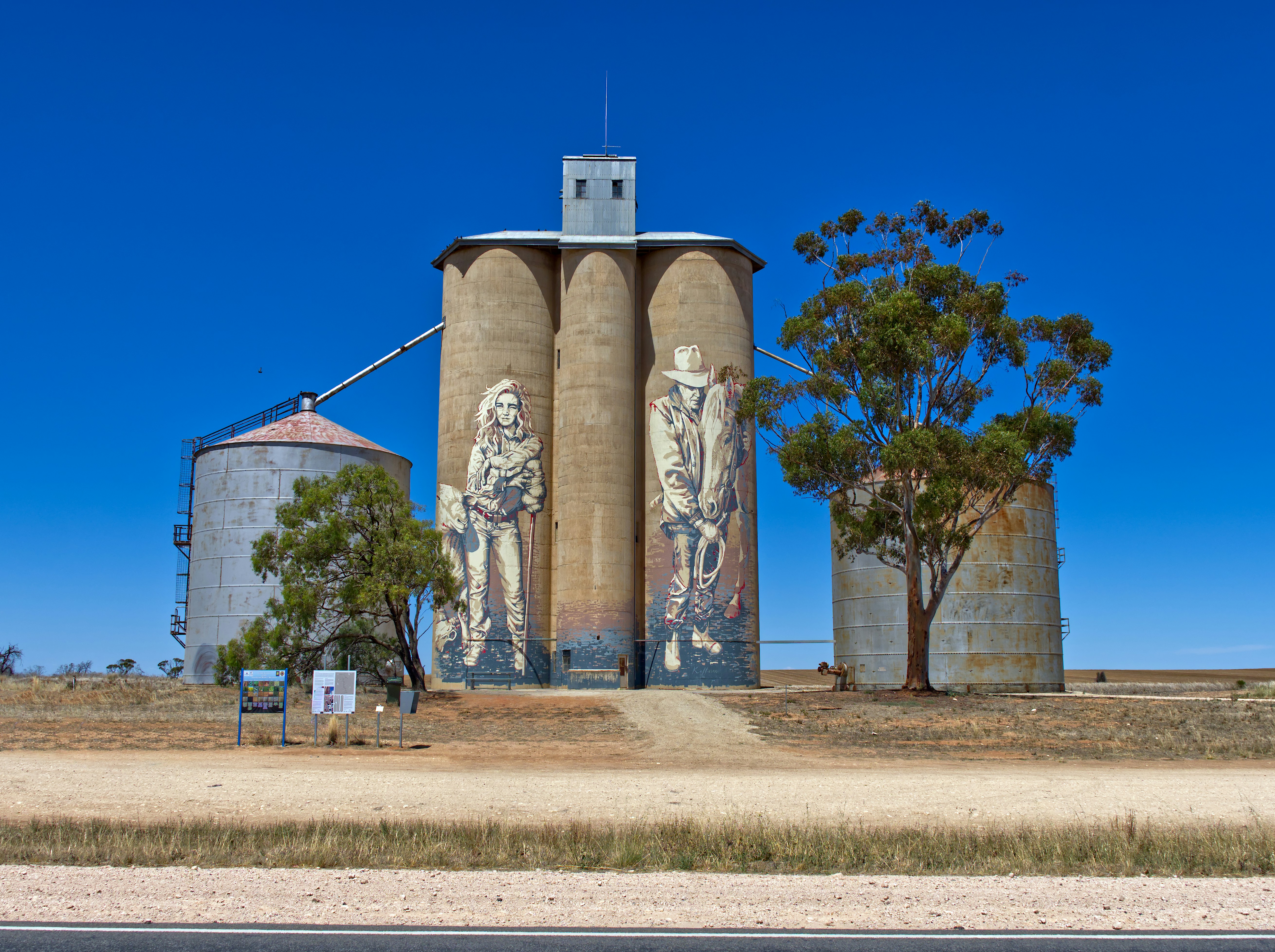 Cerulean Monoliths: Murals Adorn the Silo Row