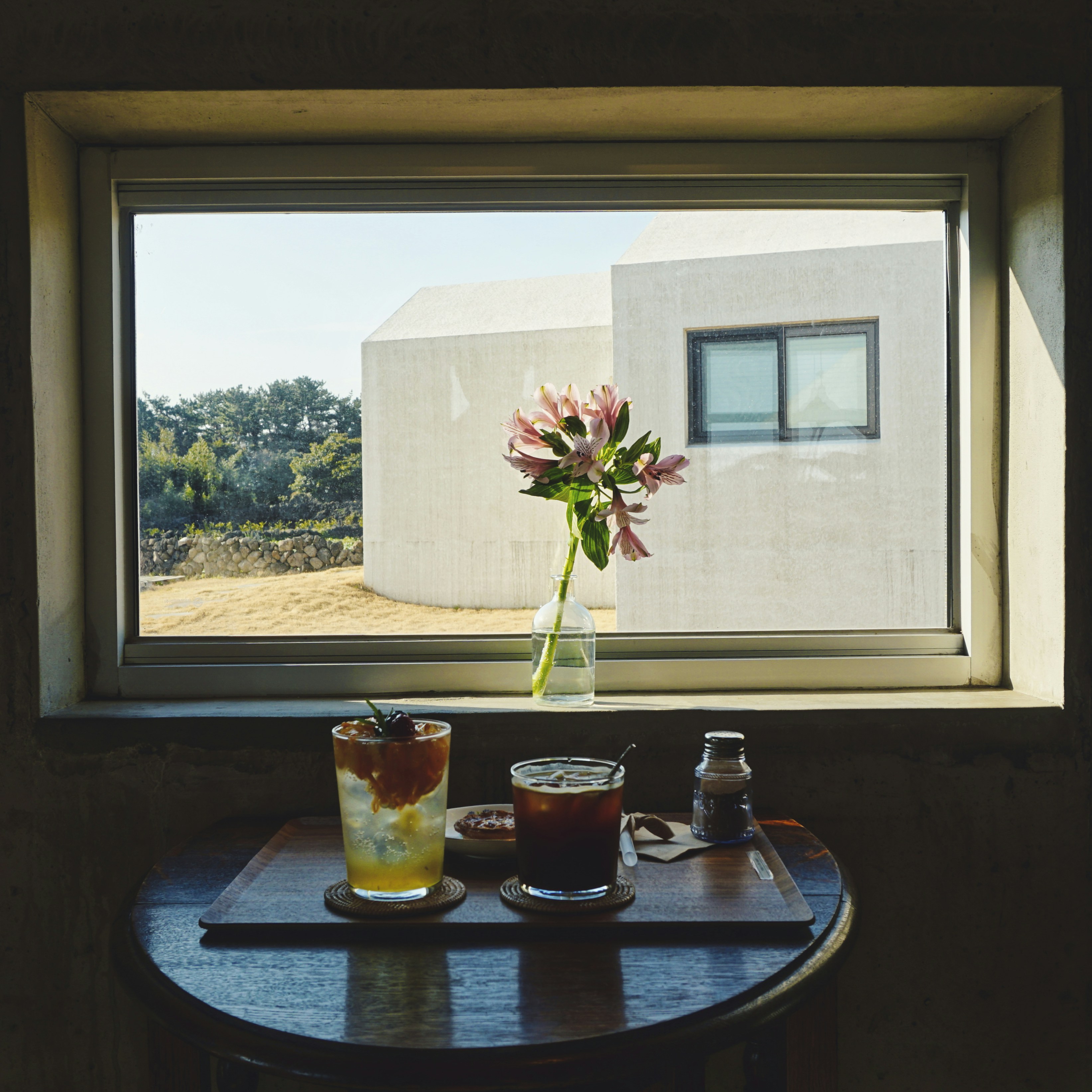 Blossoms at the Window: Quiet Morning Light on Vase and Drinks
