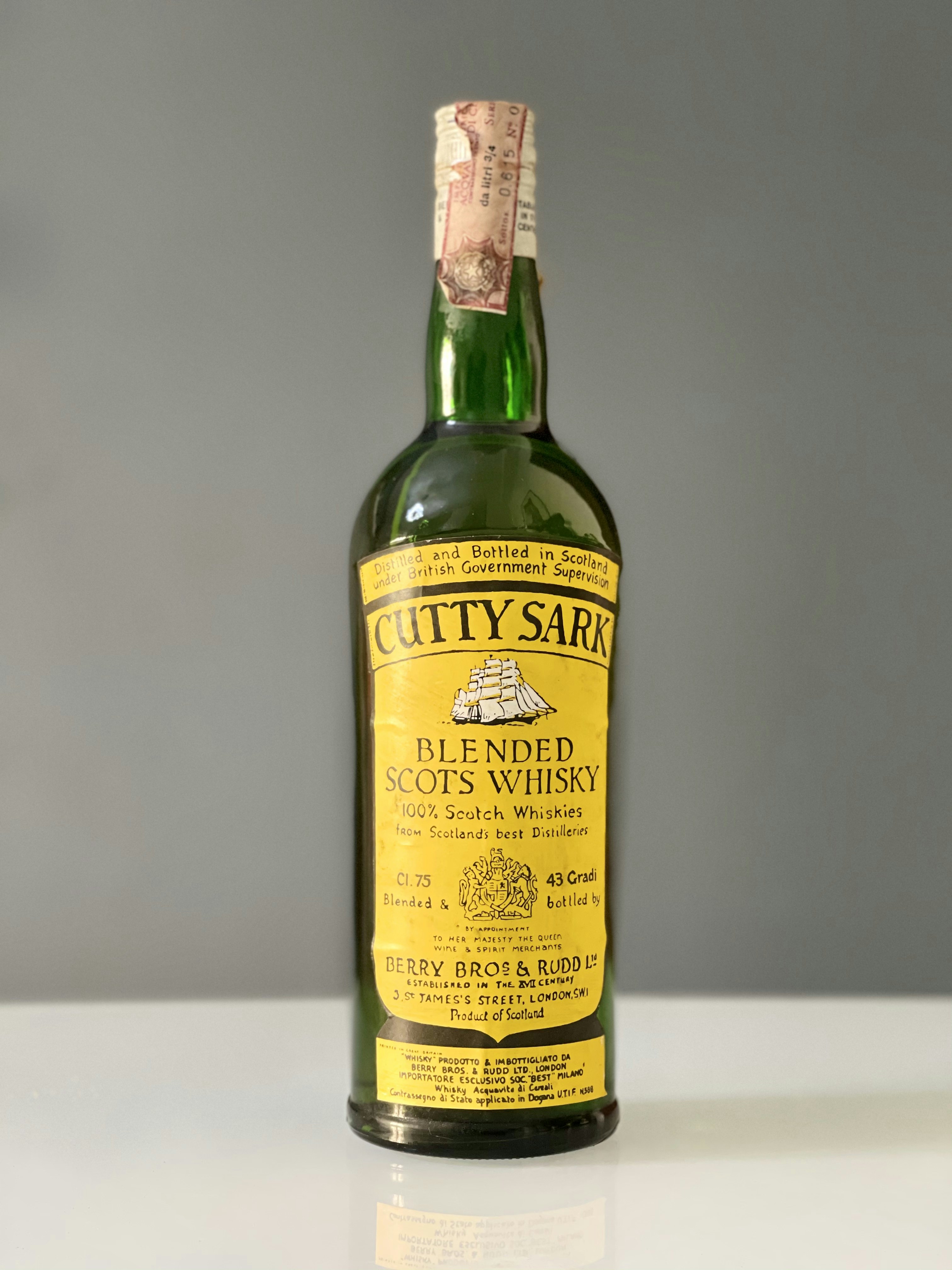 yellow labeled bottle on white table