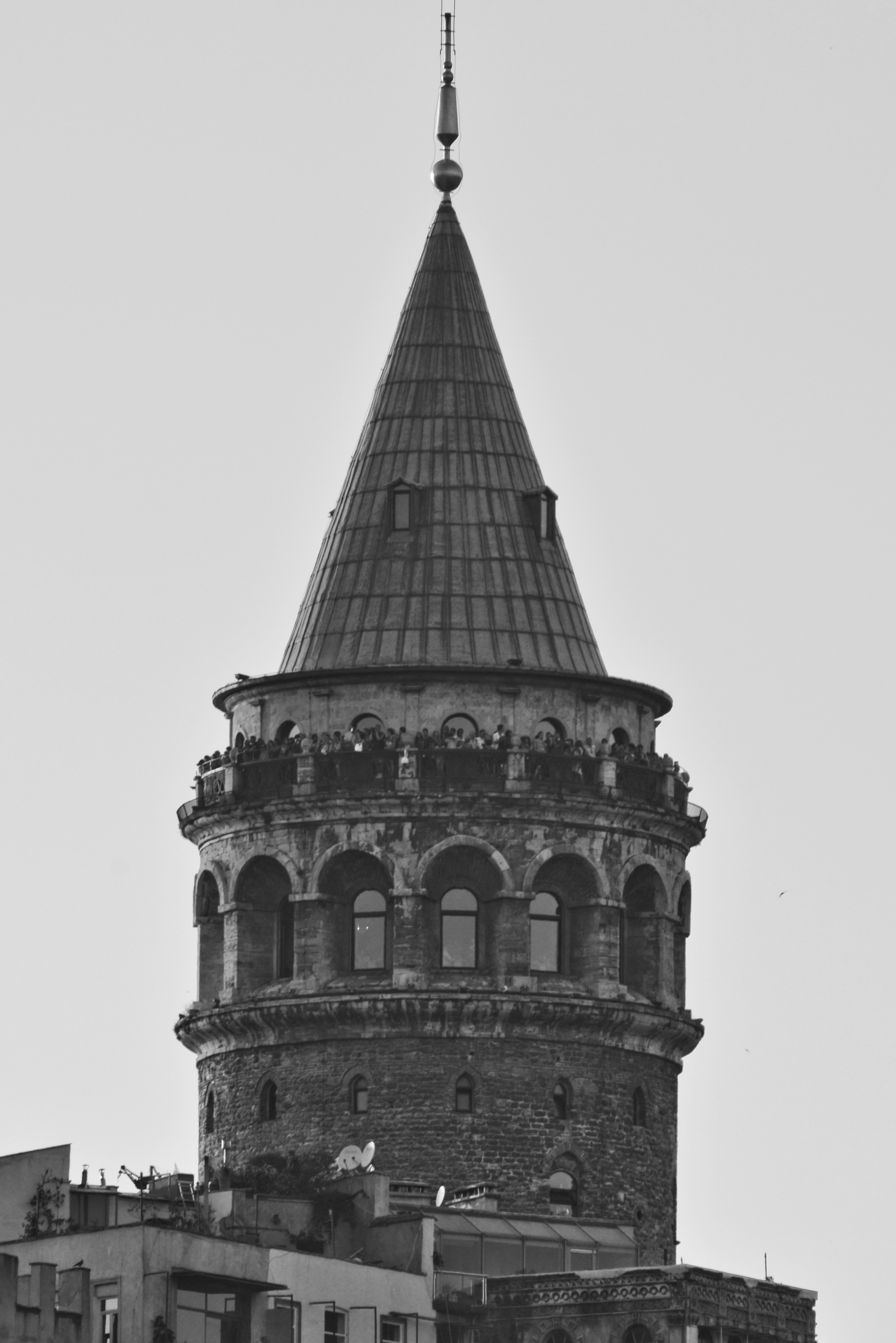 Spire in Silhouette: The Galata Tower Under a Pale Sky