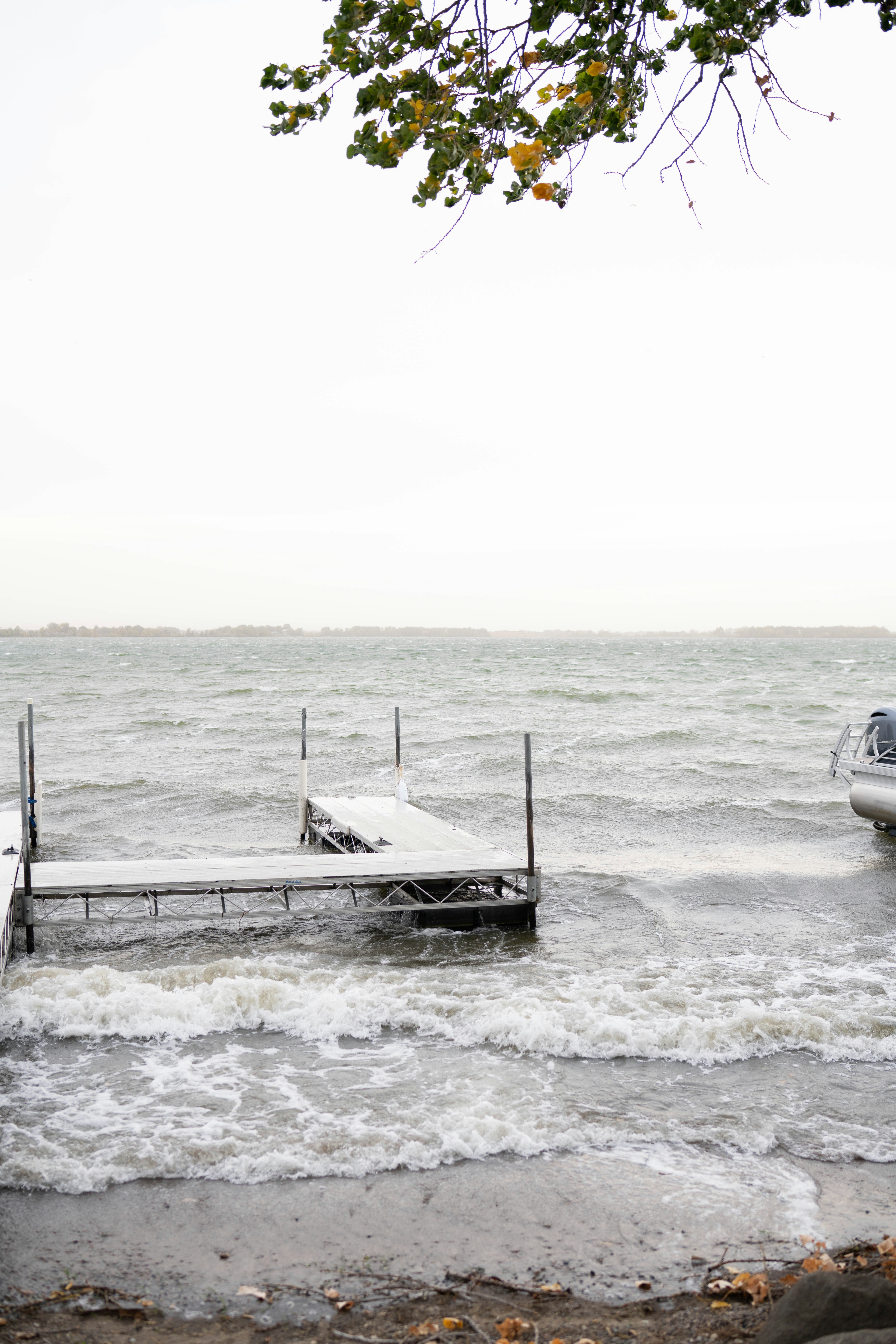 white and black boat on sea during daytime
