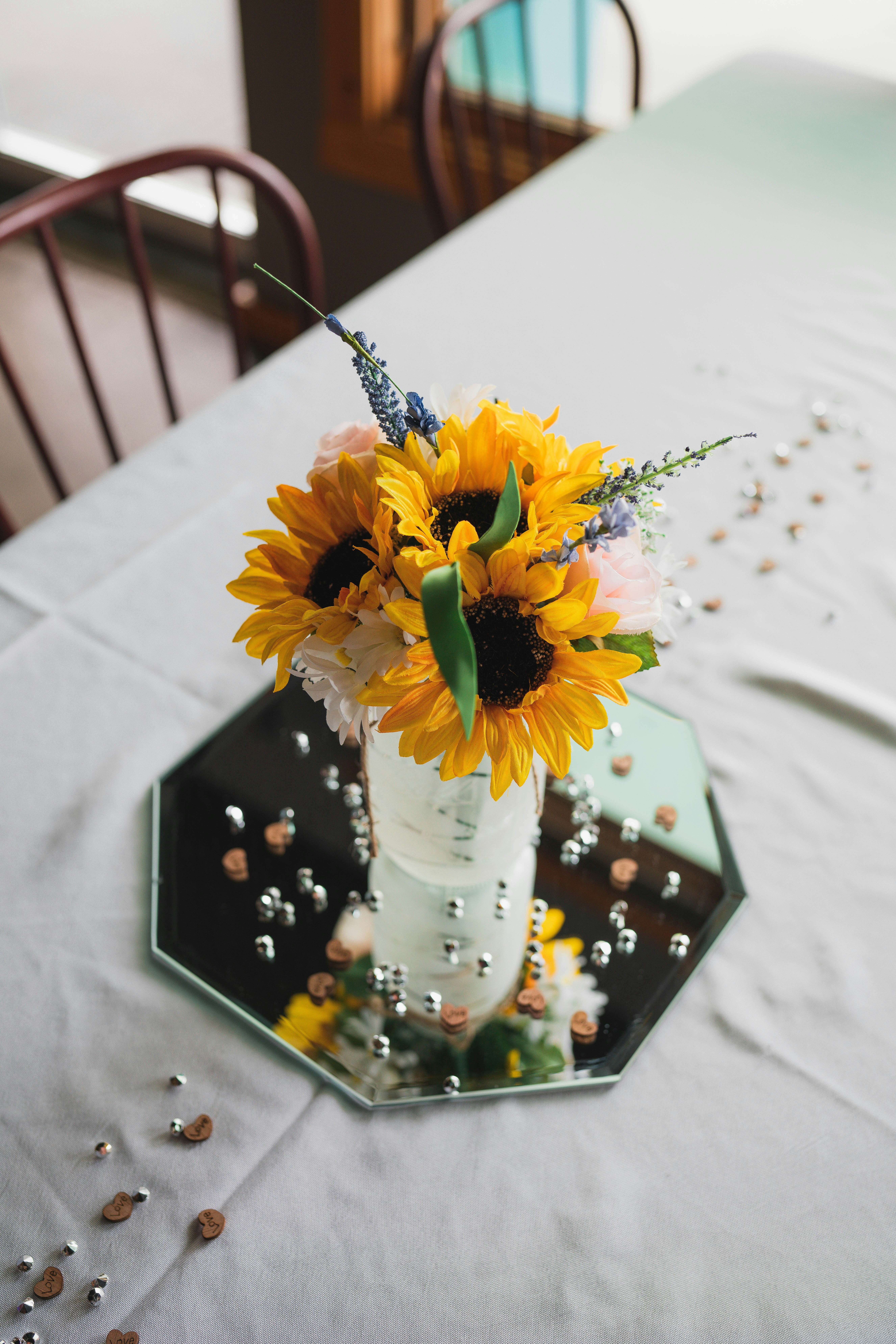 Sunflowers on a Quiet Mirror: A Tabletop Bouquet in Soft Light