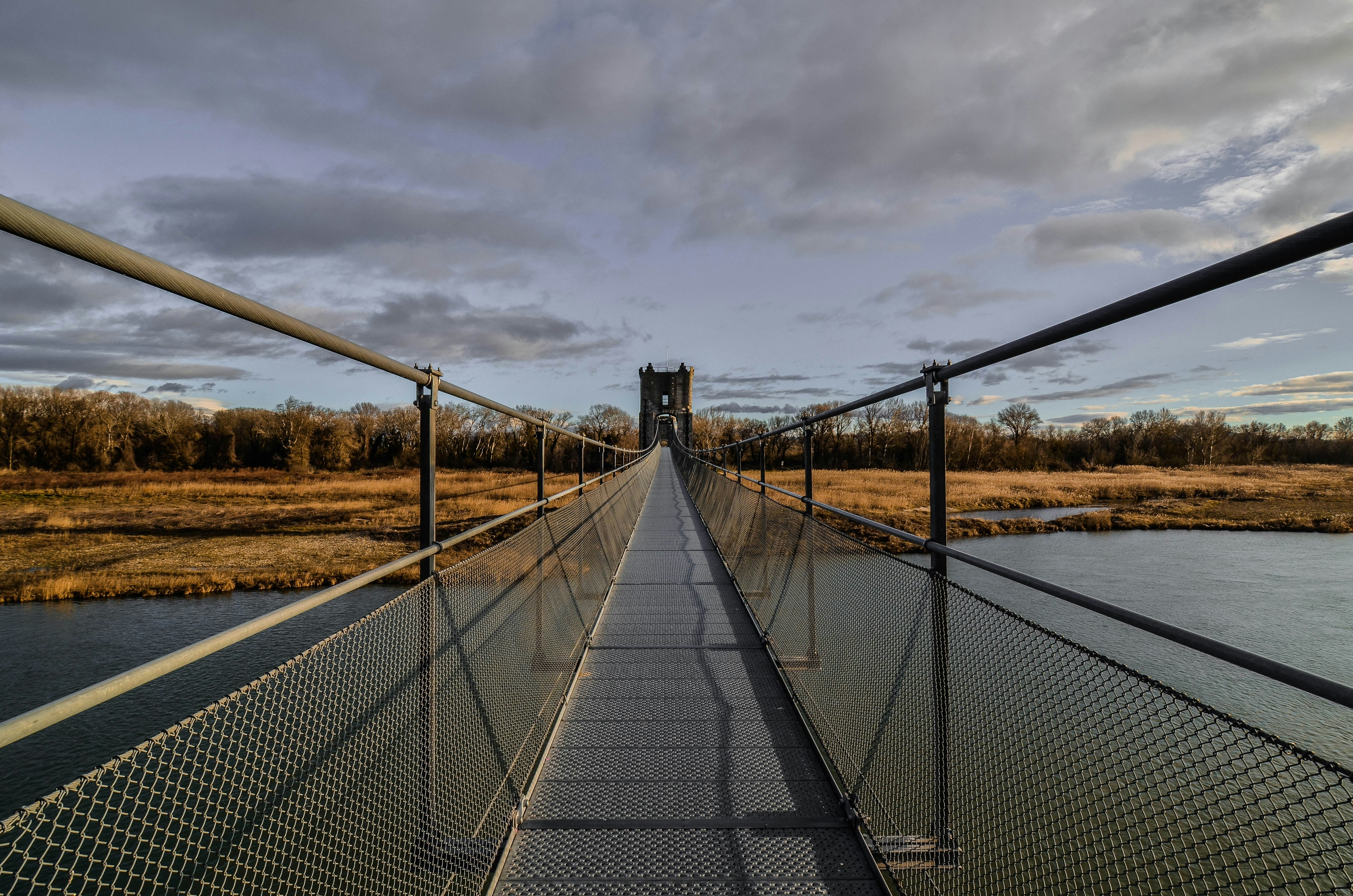 Centerline Crossing: A Narrow Suspension Bridge Toward a Tower