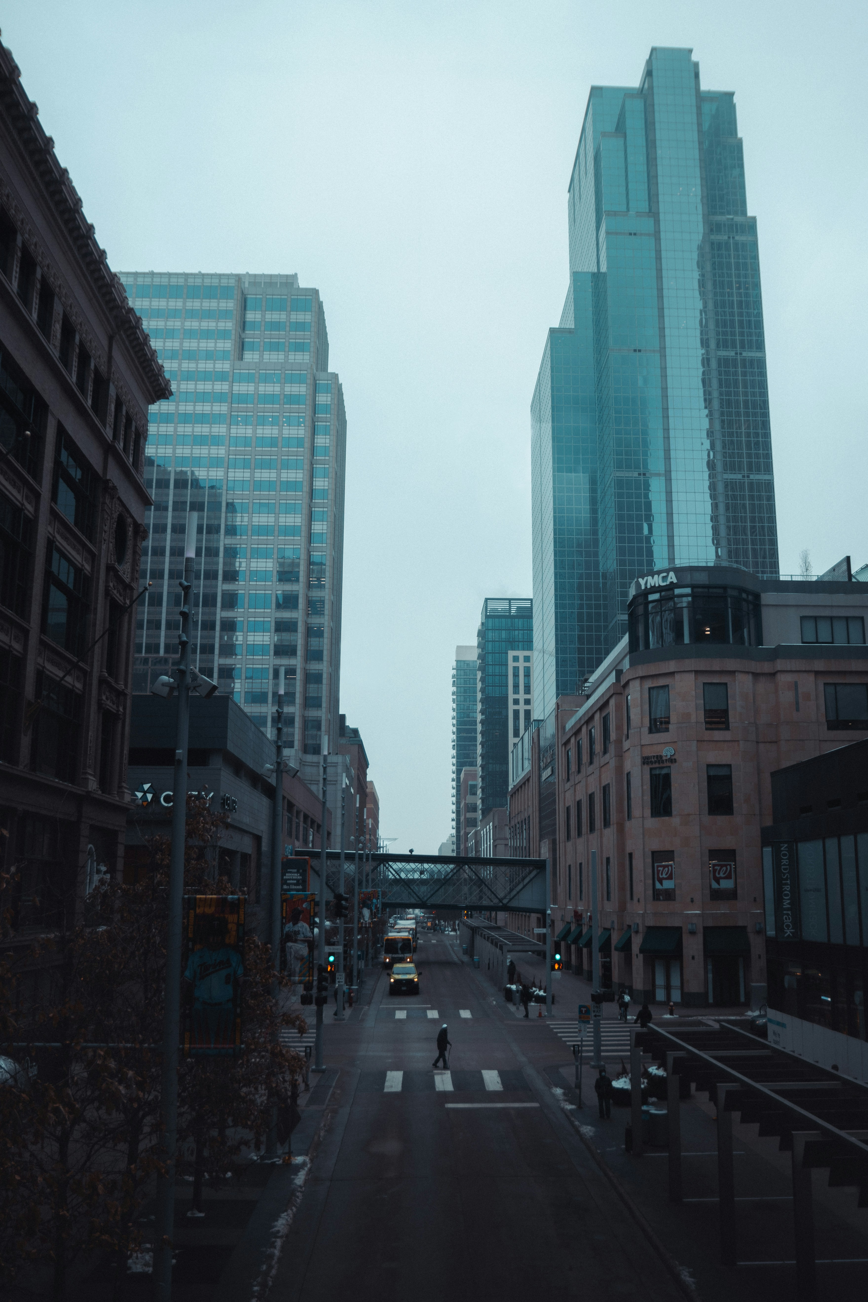 Cars on road between high rise buildings during daytime photo – Free ...