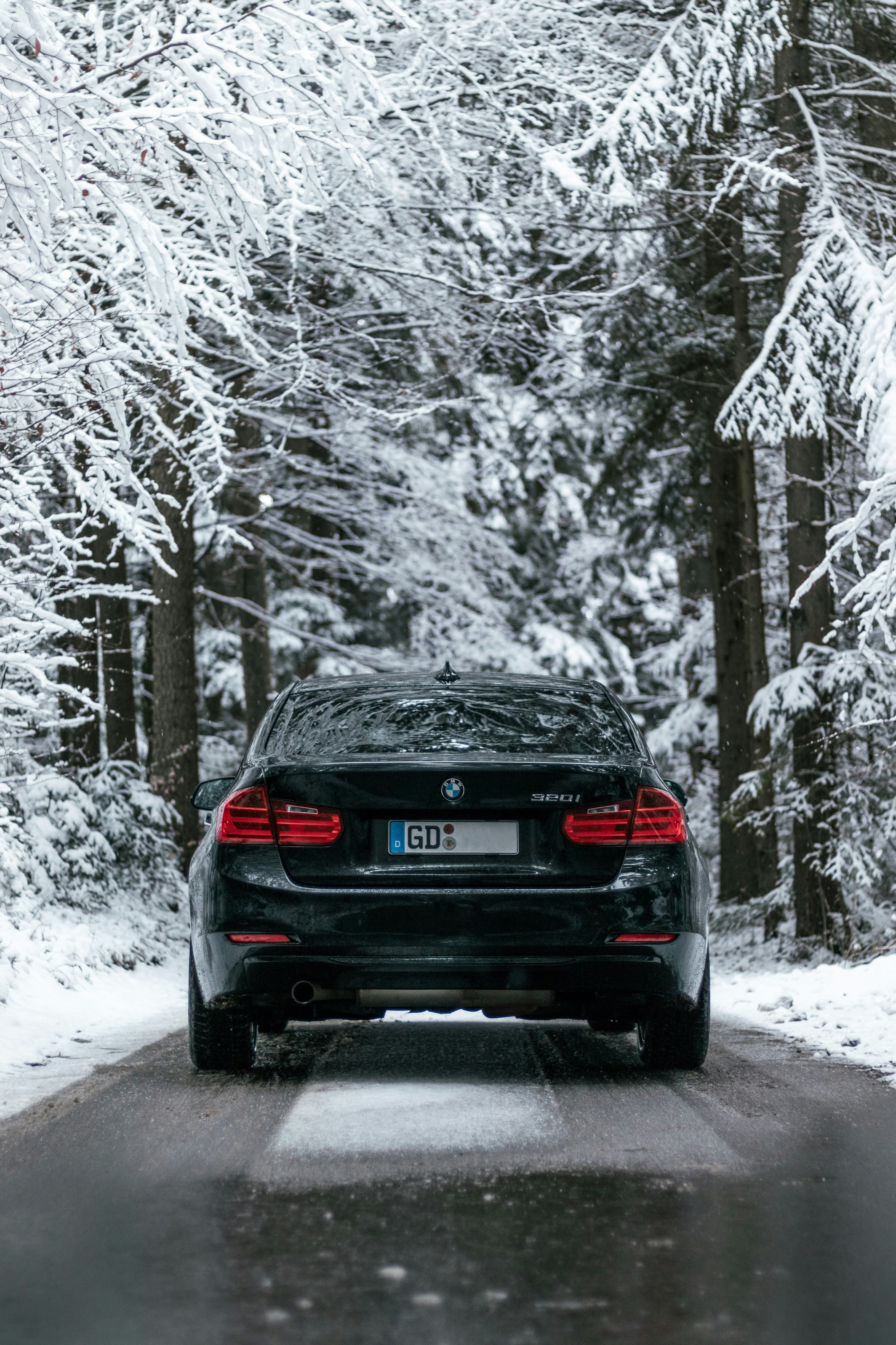 Black car on snow covered road photo – Free Automobile Image on Unsplash