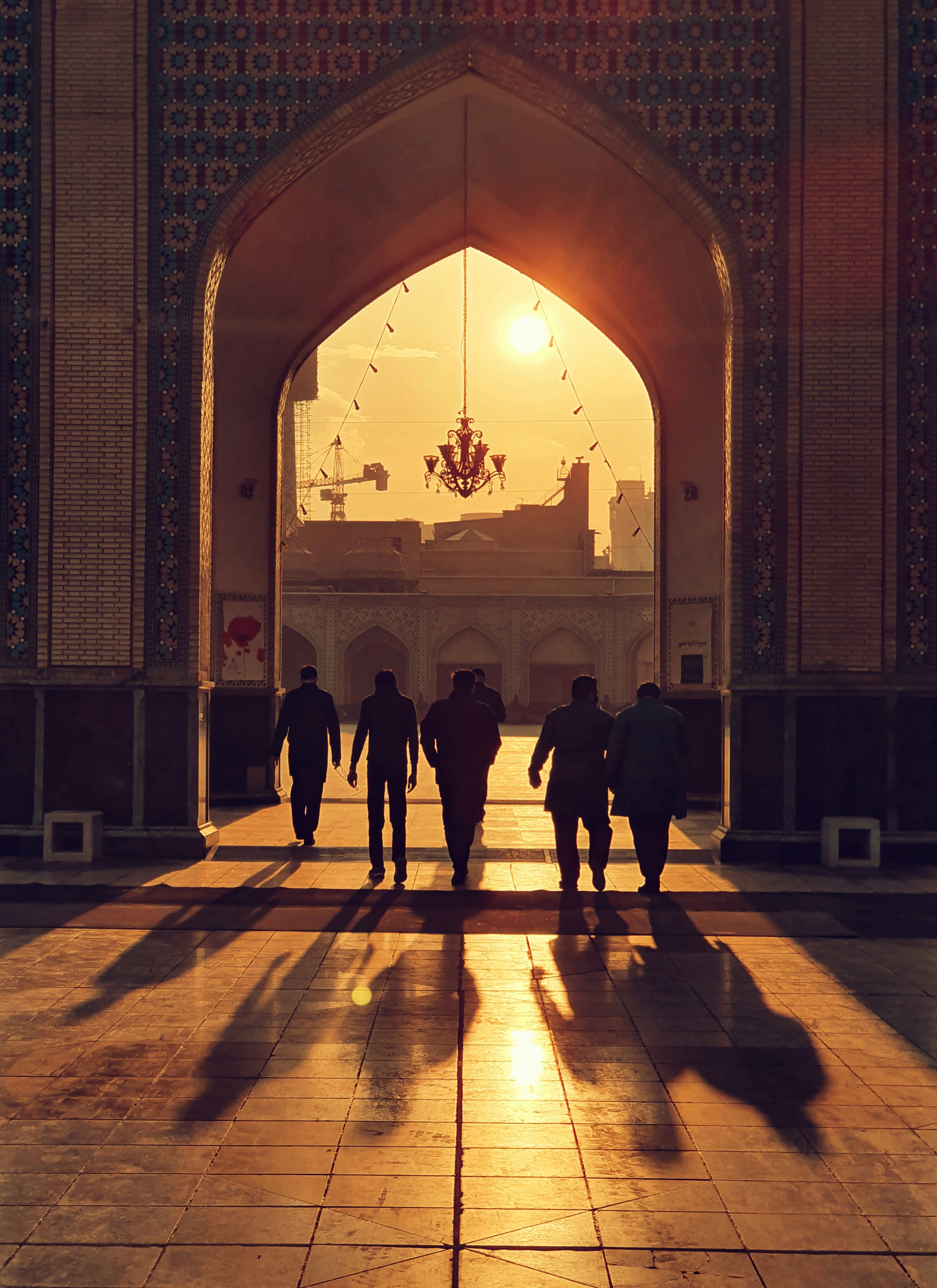 People standing in front of brown concrete building photo – Free People ...