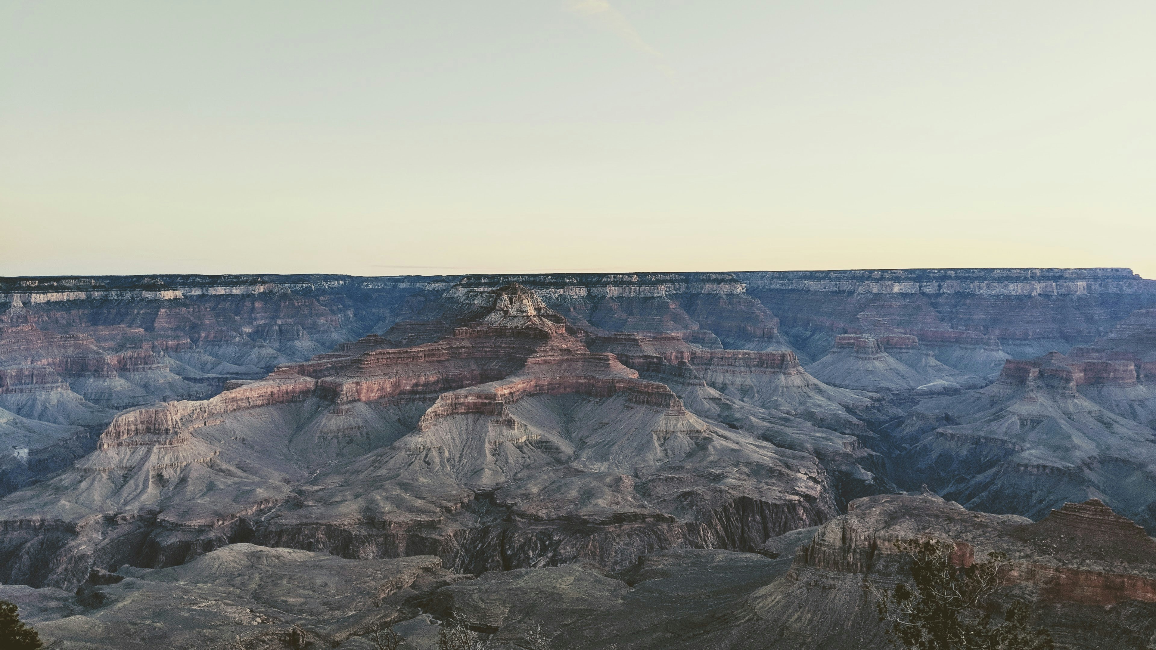 Echoes of the Grand Canyon: Sunlit Layered Cliffs at Dusk