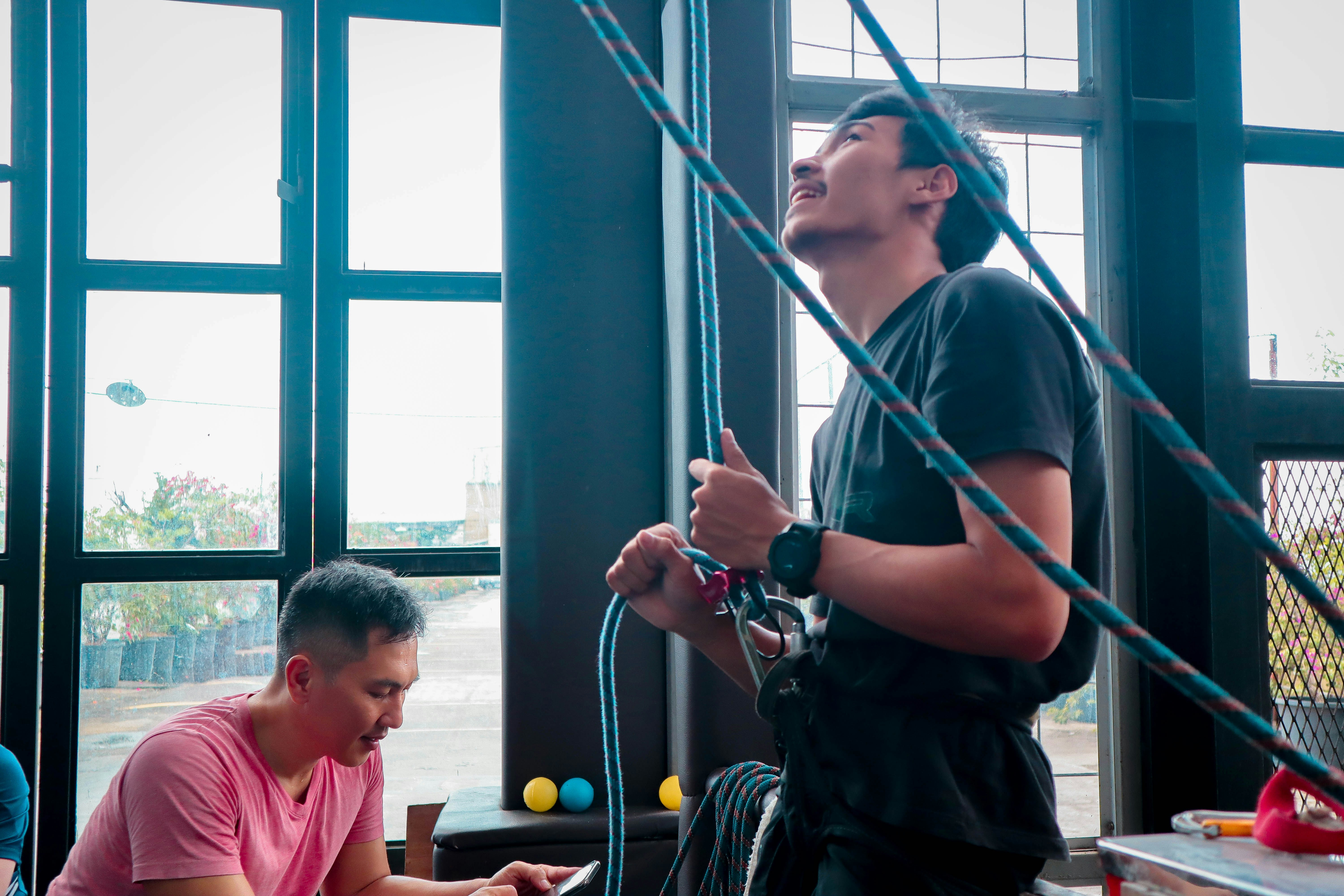 Rope Tension and Focus: A climber at the edge of ascent