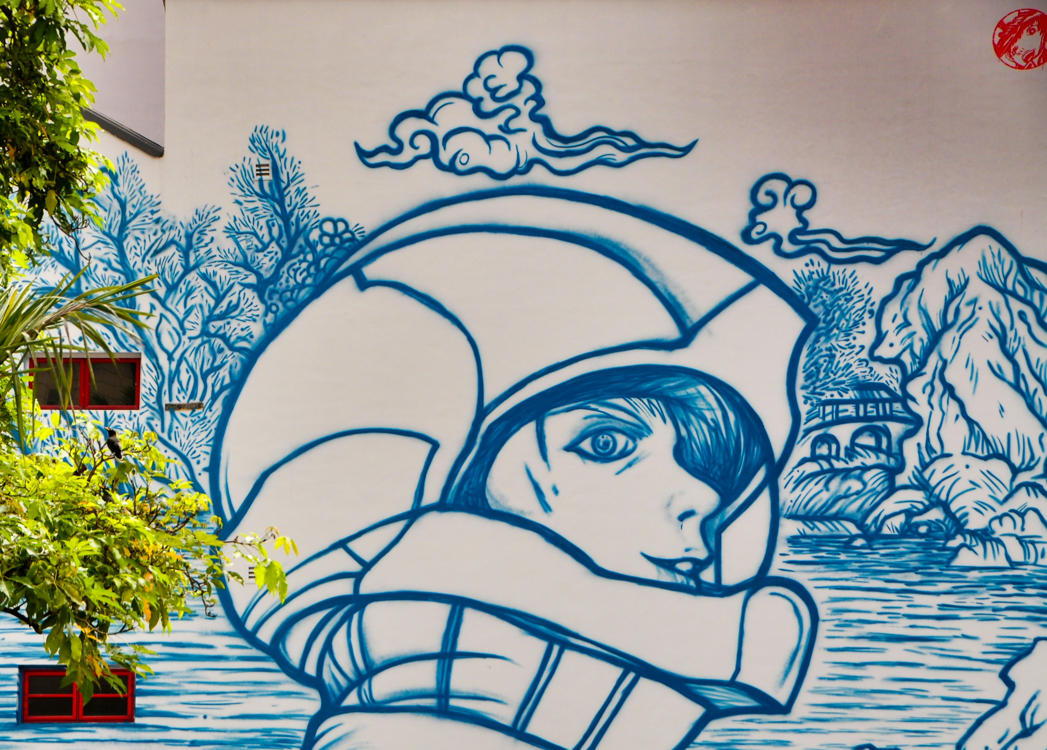 Indigo-Line Portrait: Helmeted Gaze Over a Riverside Mural