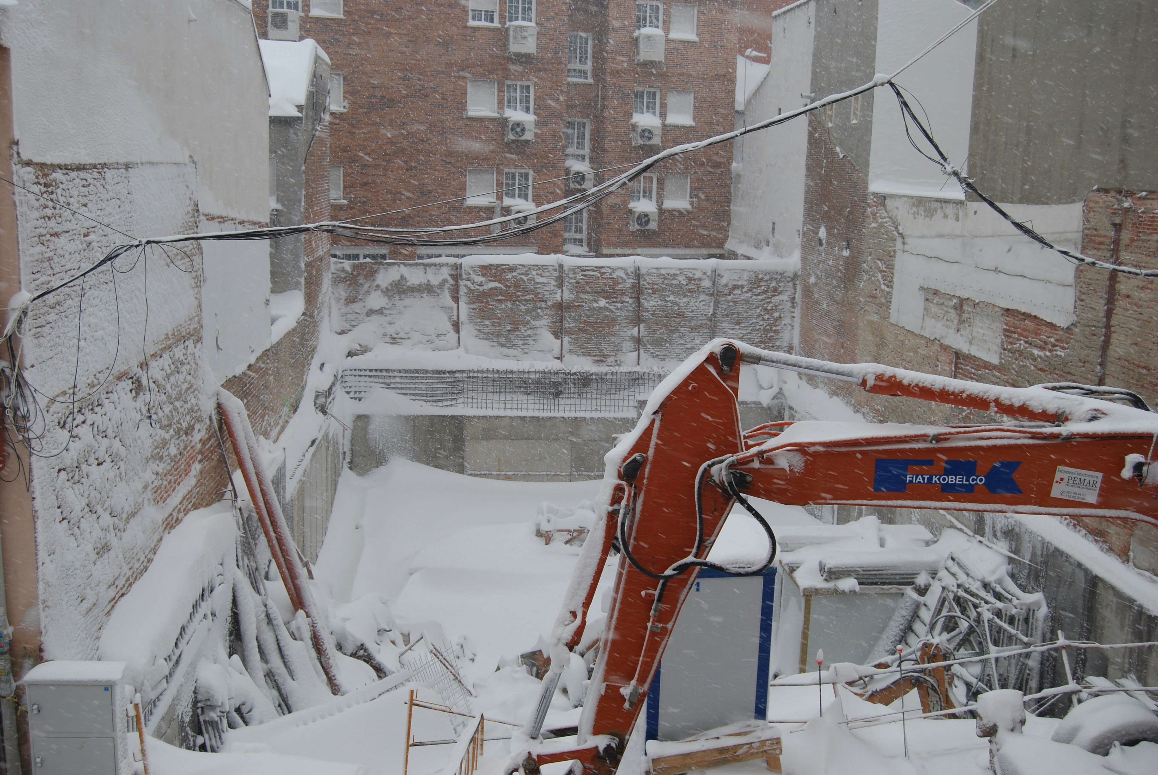 Brown concrete building covered with snow during daytime photo – Free ...