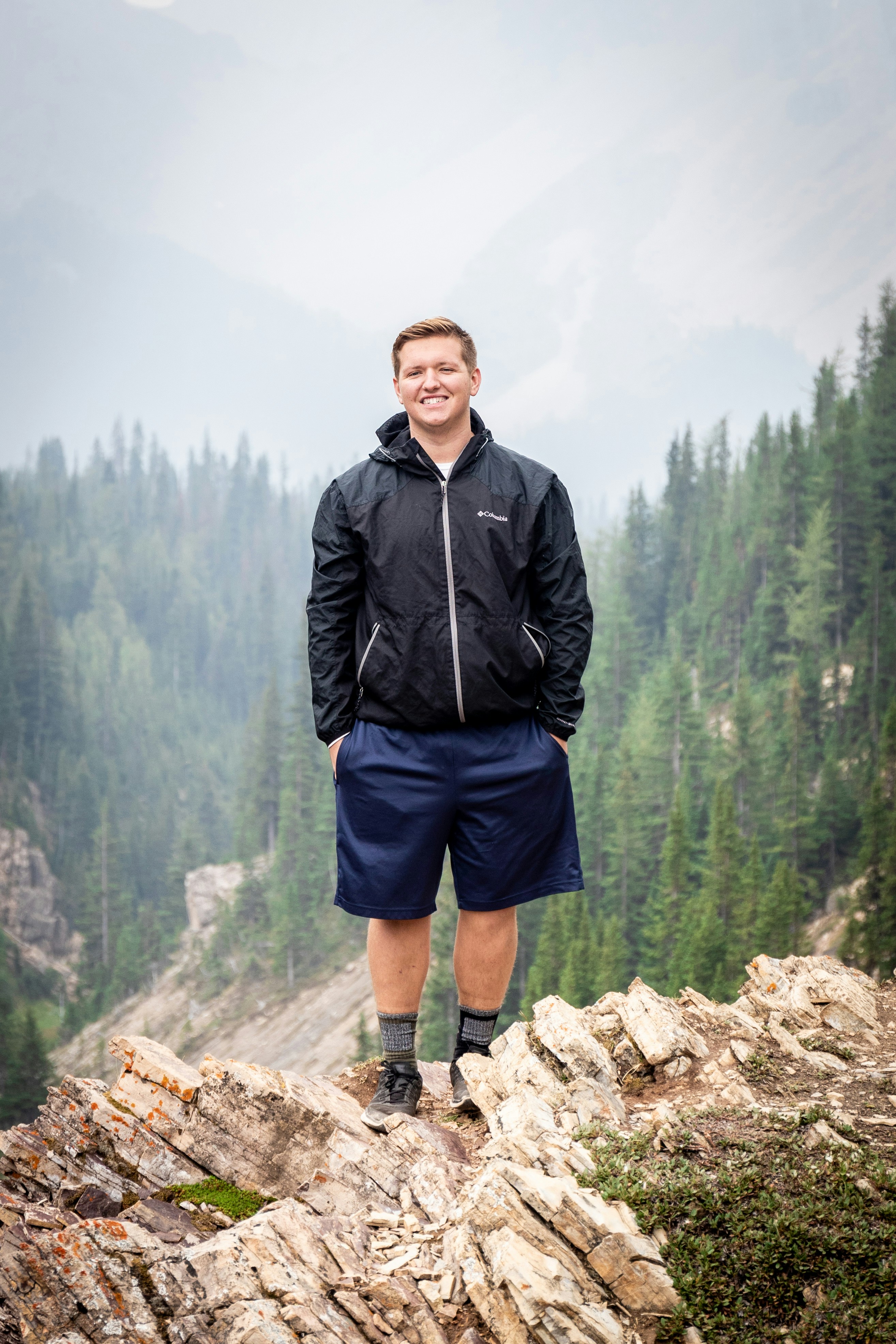 Guy standing on mountain in Banff, Canada.