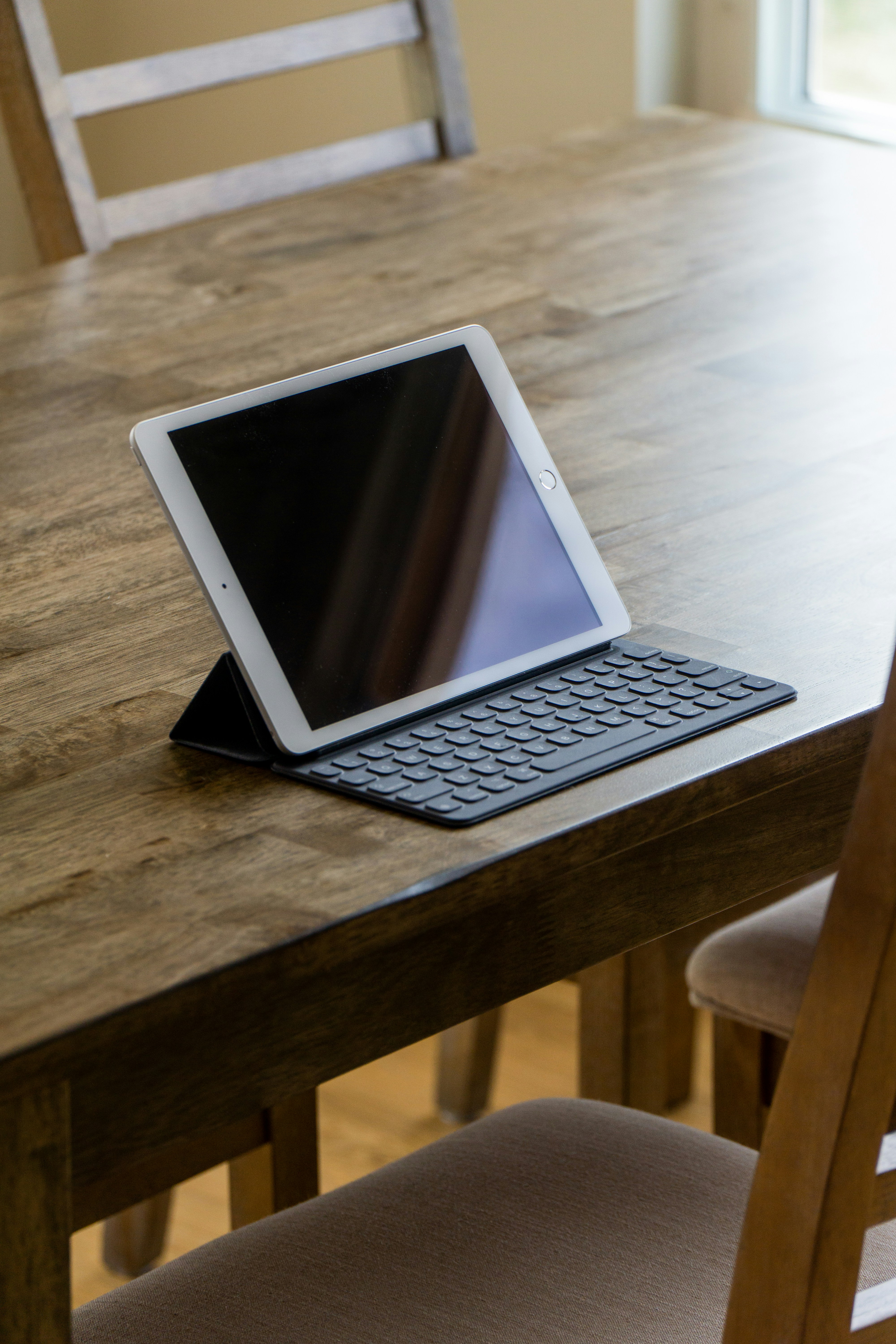 Tablet on a Rustic Dining Table with Keyboard Stand