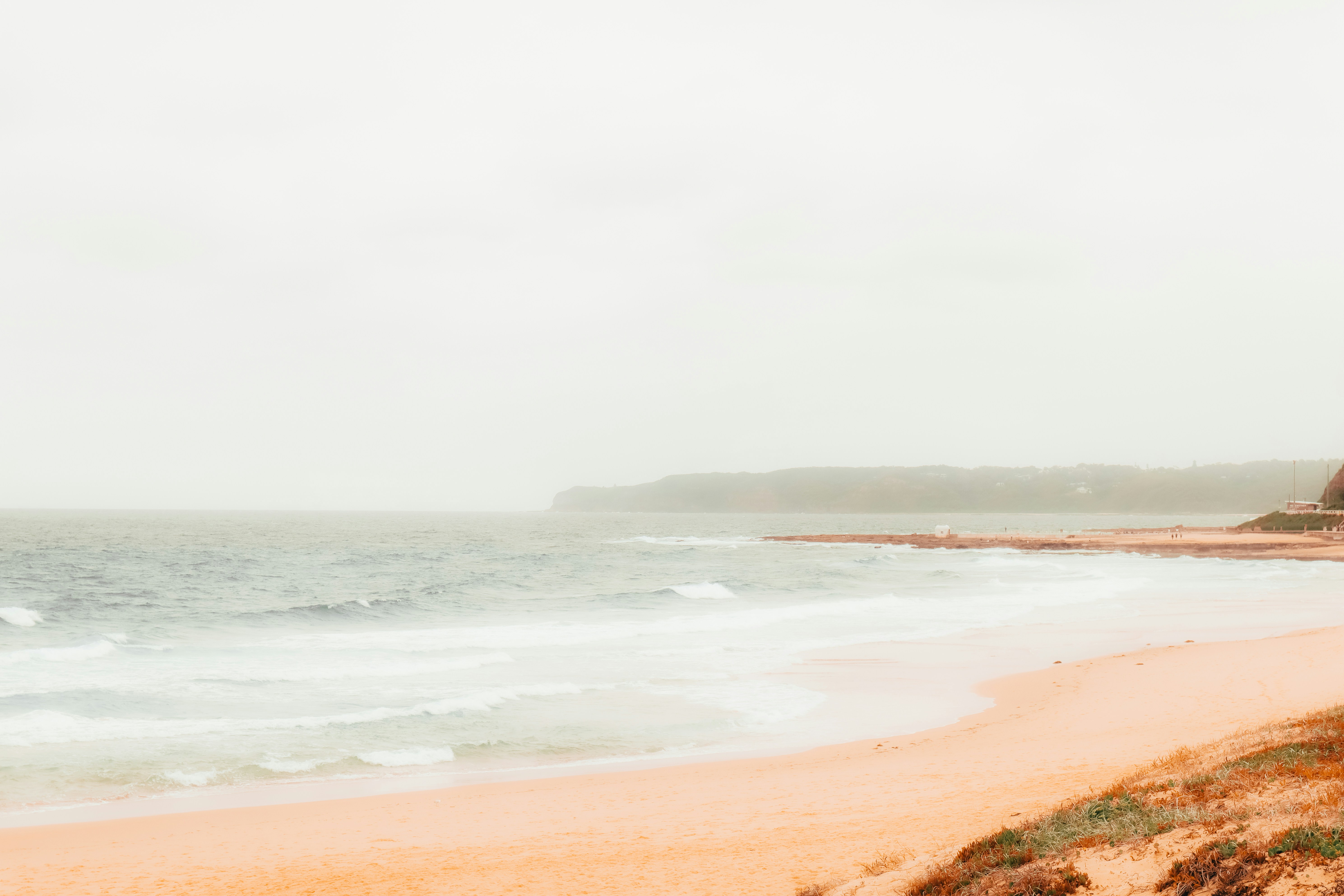 Horizon hush: a sunlit, wind-swept shoreline