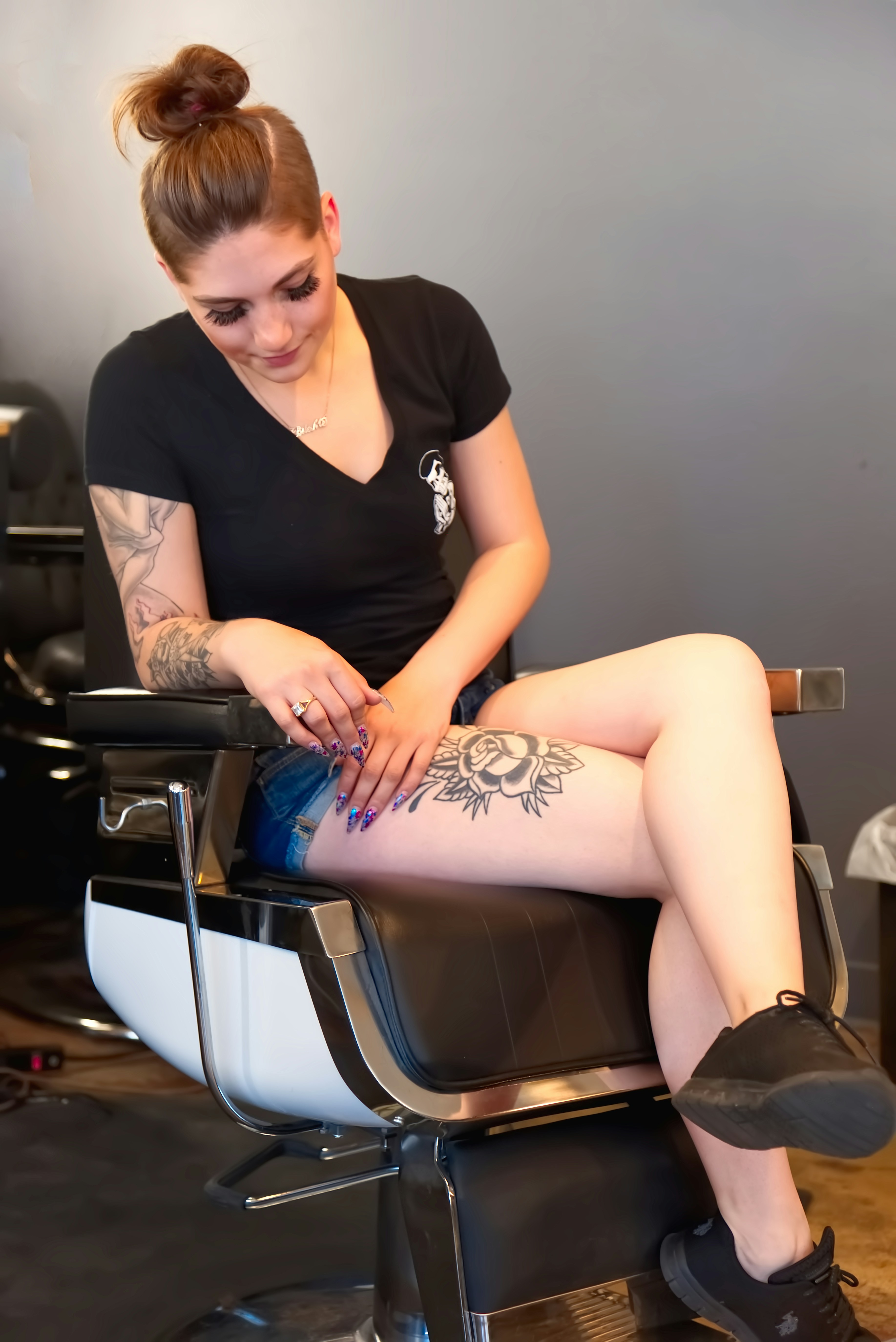 Ink and Quiet Confidence in a Vintage Barber Chair
