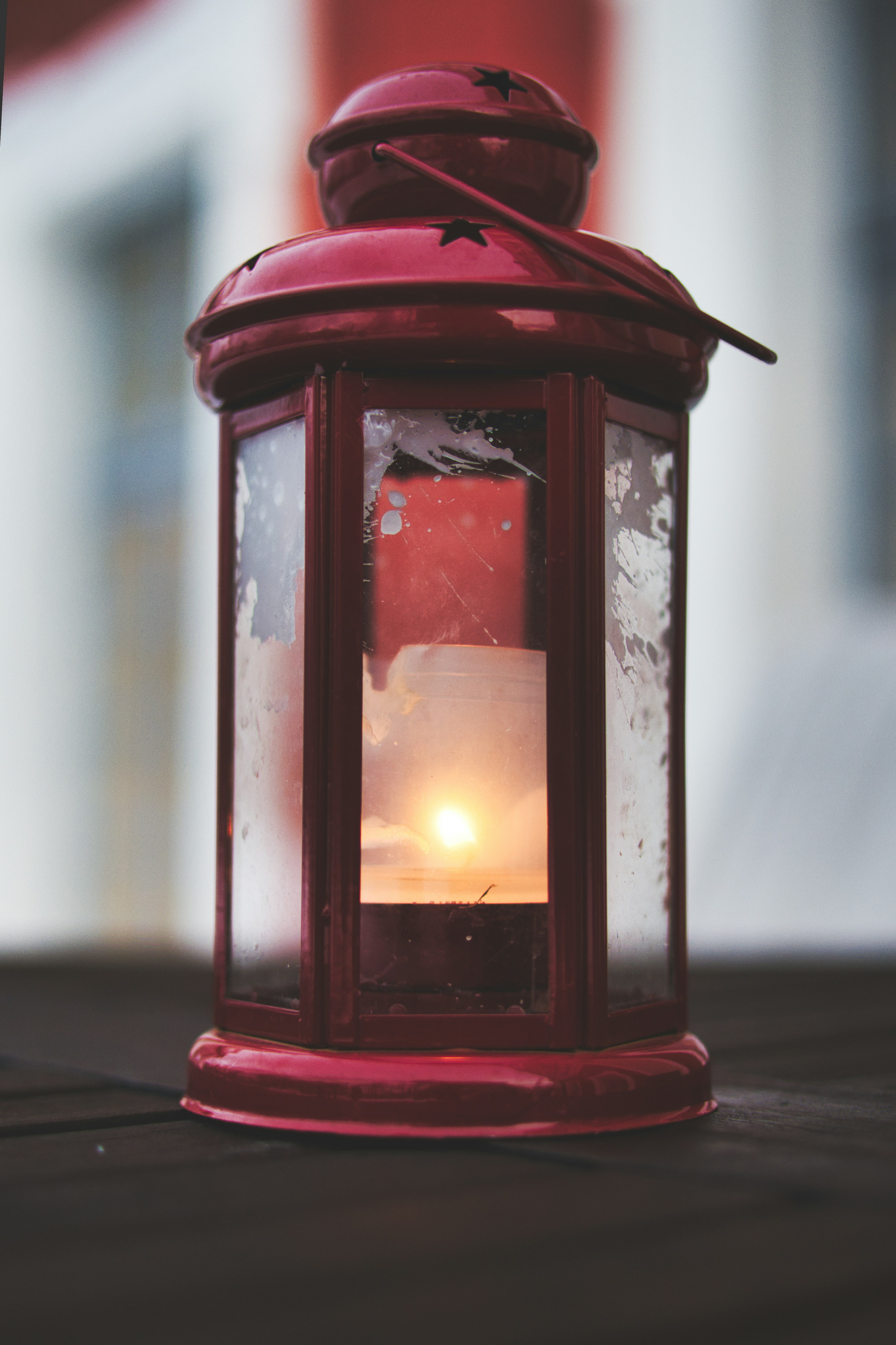 Red Lantern Glow: A Quiet Flame on a Weathered Lantern