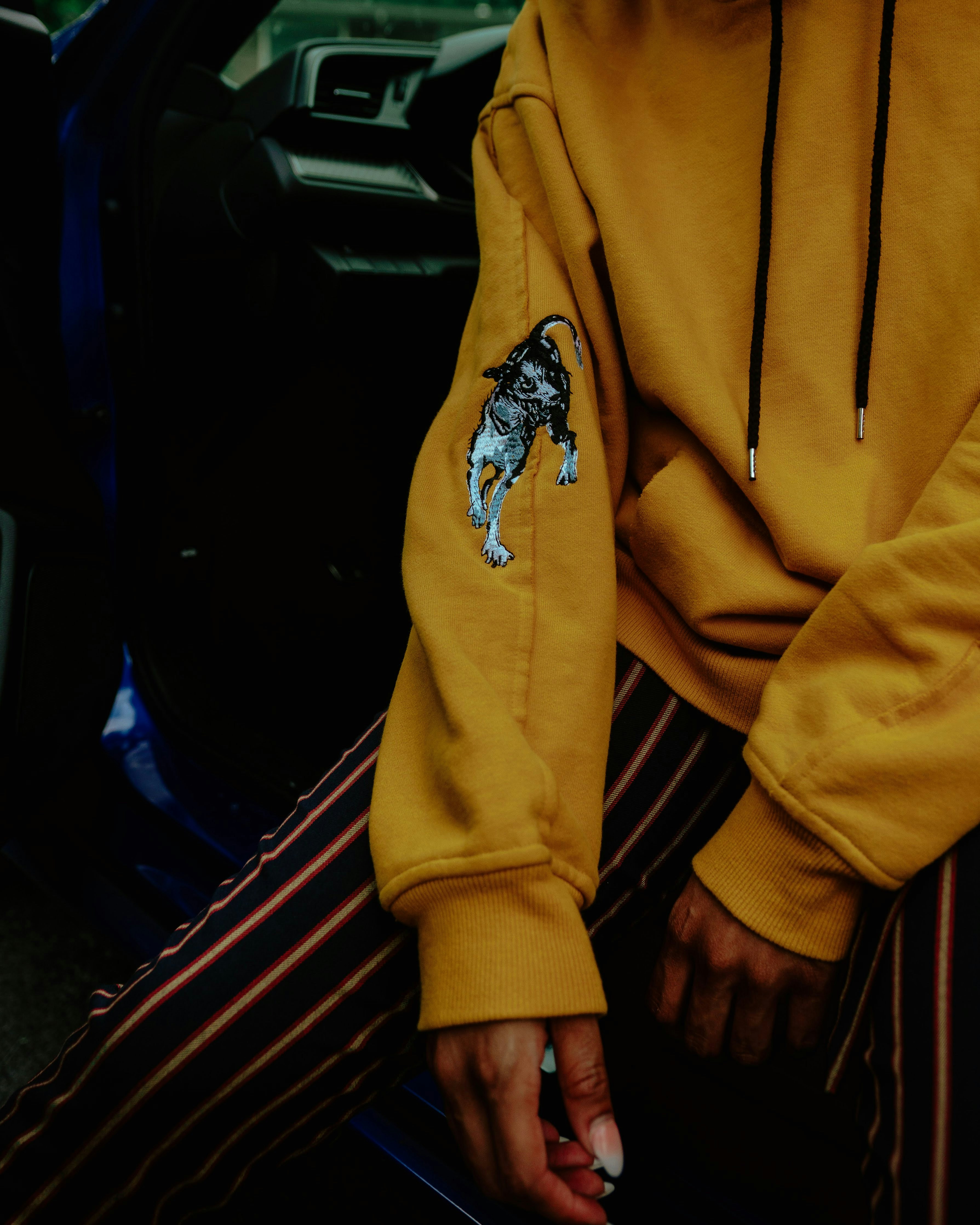 person in yellow and black striped long sleeve shirt