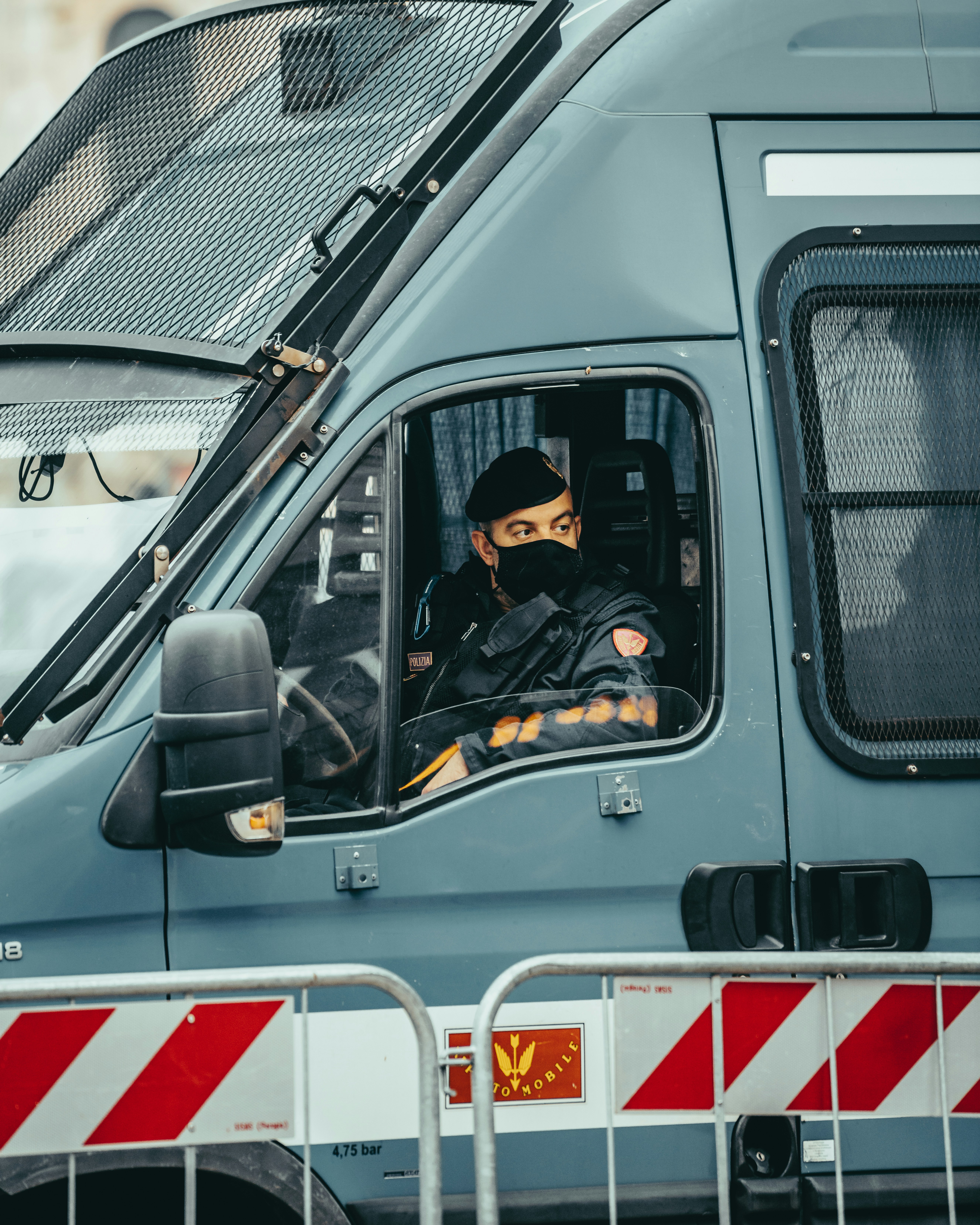 Driver in Shadow: A Vigilant Moment Inside the Cab of a Utility Truck