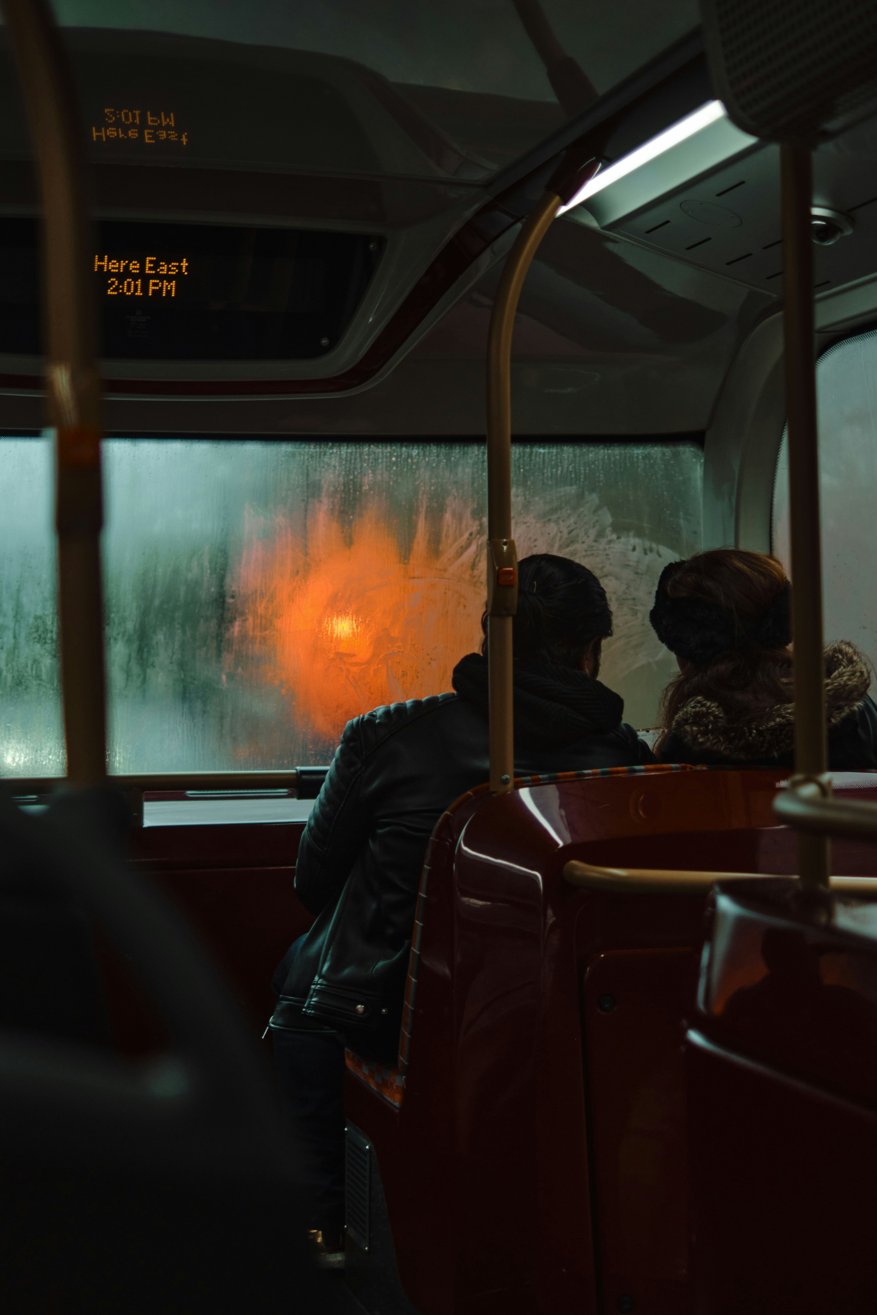Warm Glimmer Through a Fogged Bus Window
