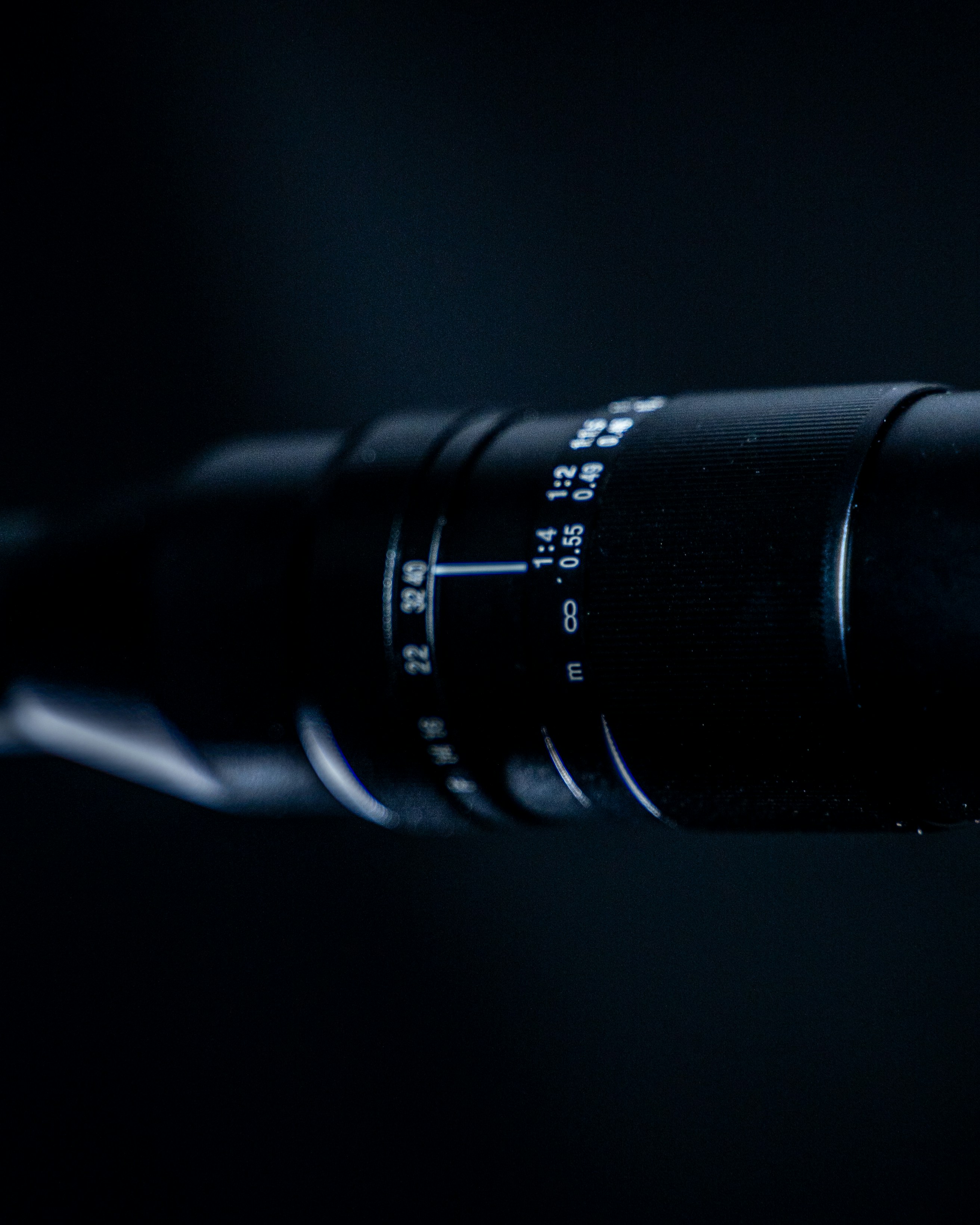 Dimly Lit Telephoto Ring: A Close-Up of Precision Markings