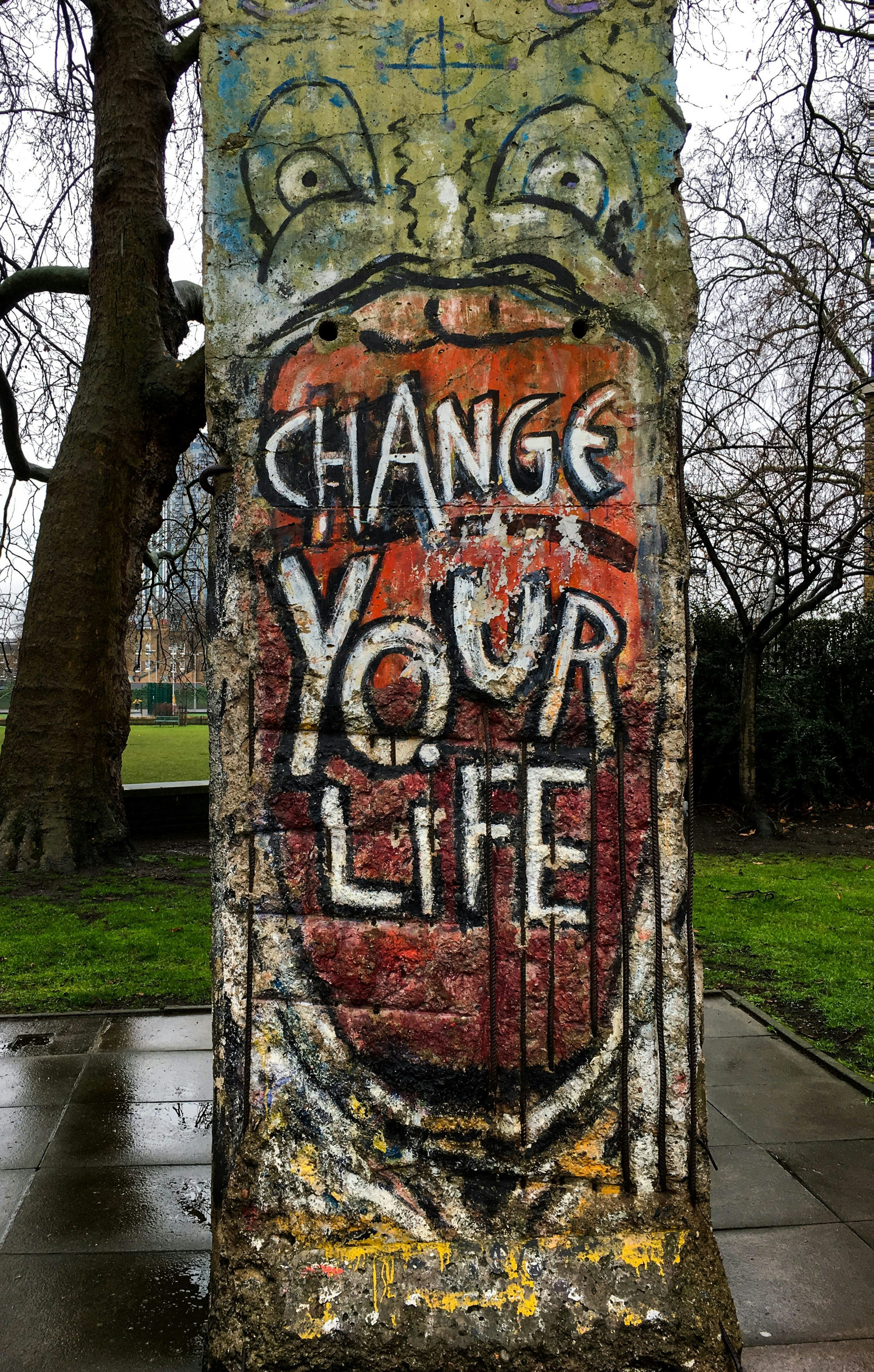 Change Your Life: Graffiti Sermon on a Weathered Park Column