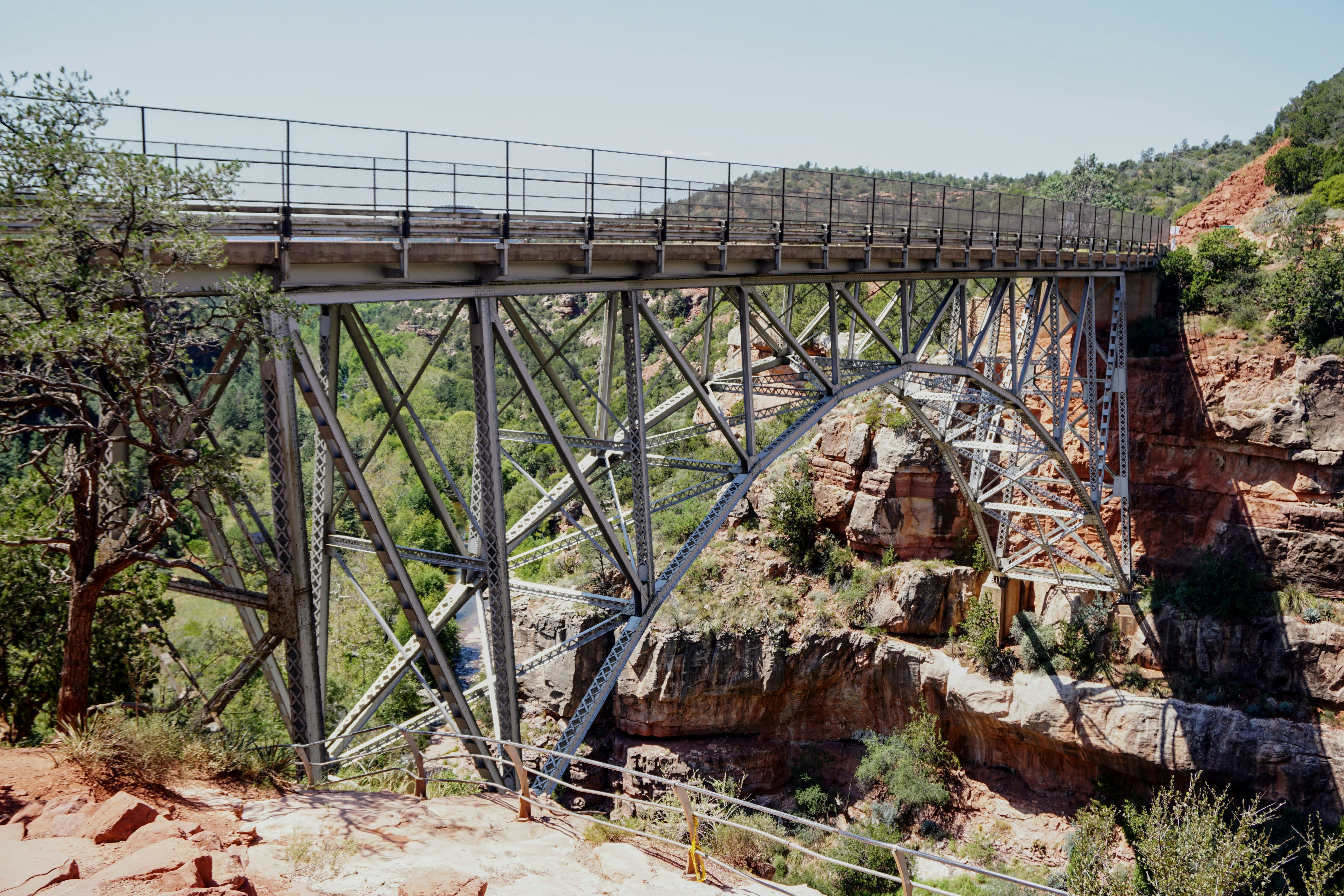 gray metal bridge over river during daytime