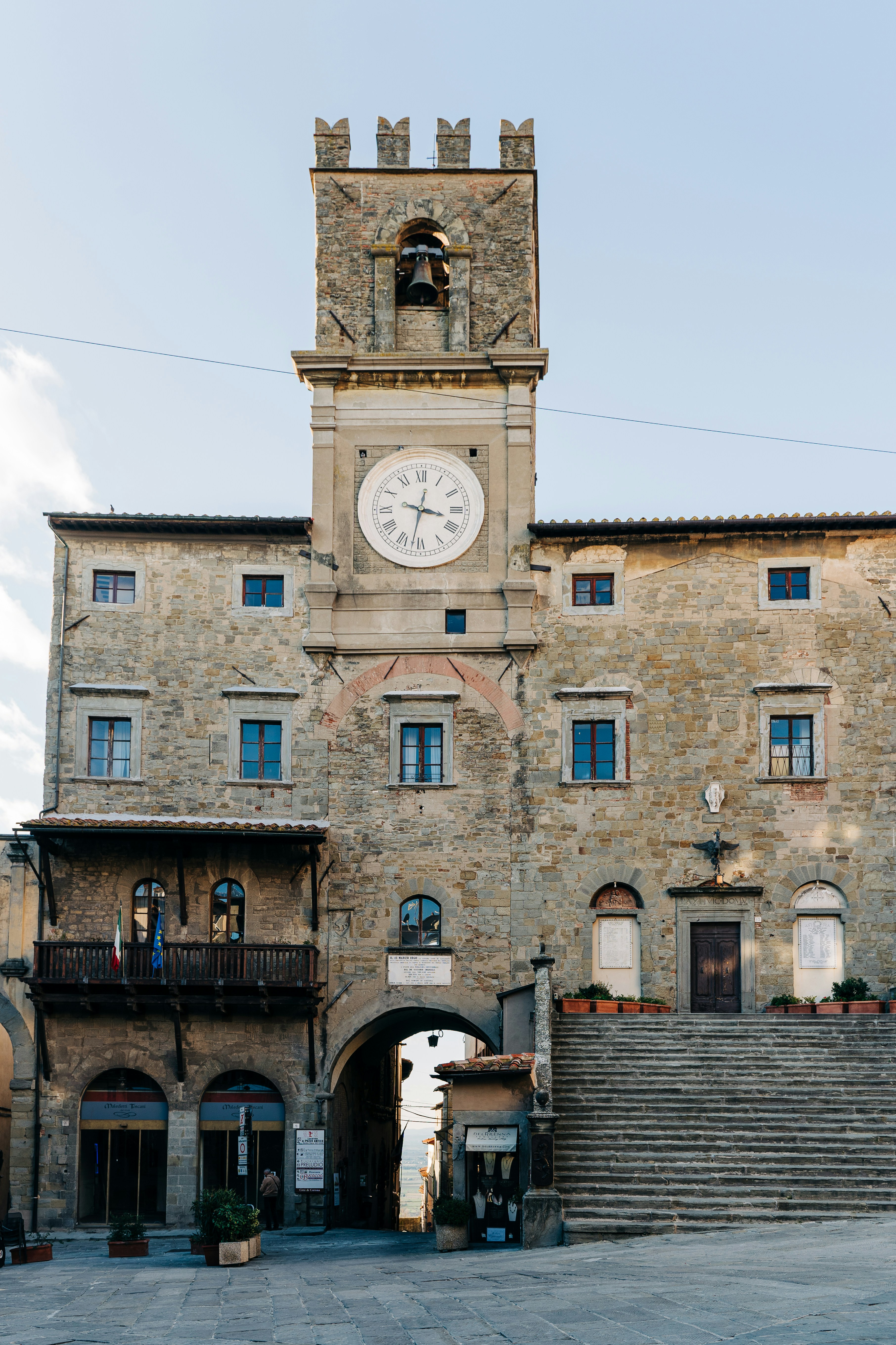 The main square in Cortona, Tuscany, Italy | brown concrete building under white sky during daytime