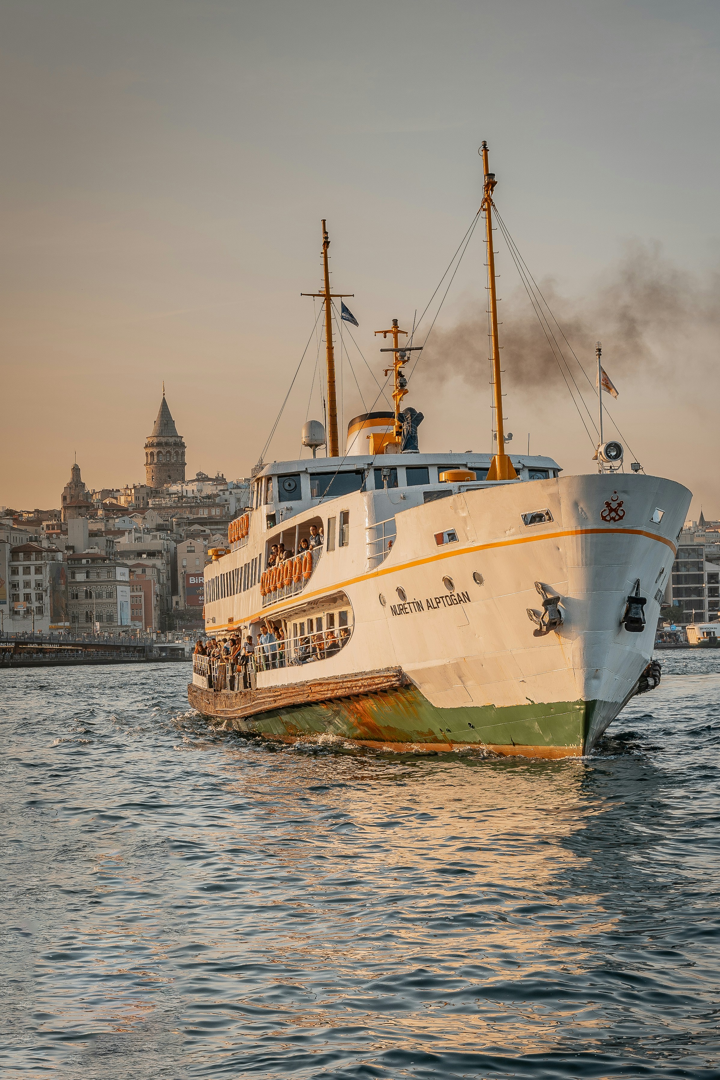 White and yellow ship on water near buildings during daytime photo ...