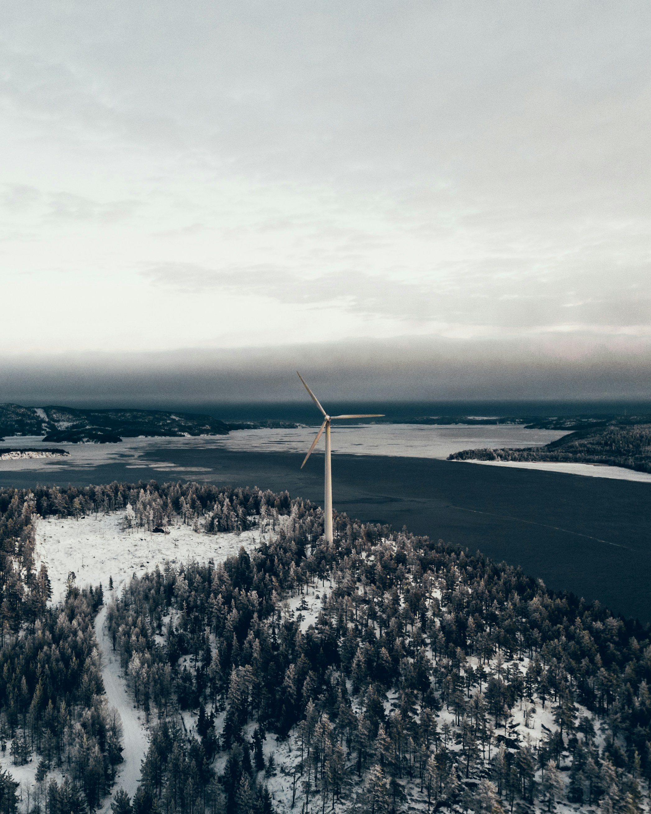 White wind turbine on snow covered ground during daytime photo – Free ...