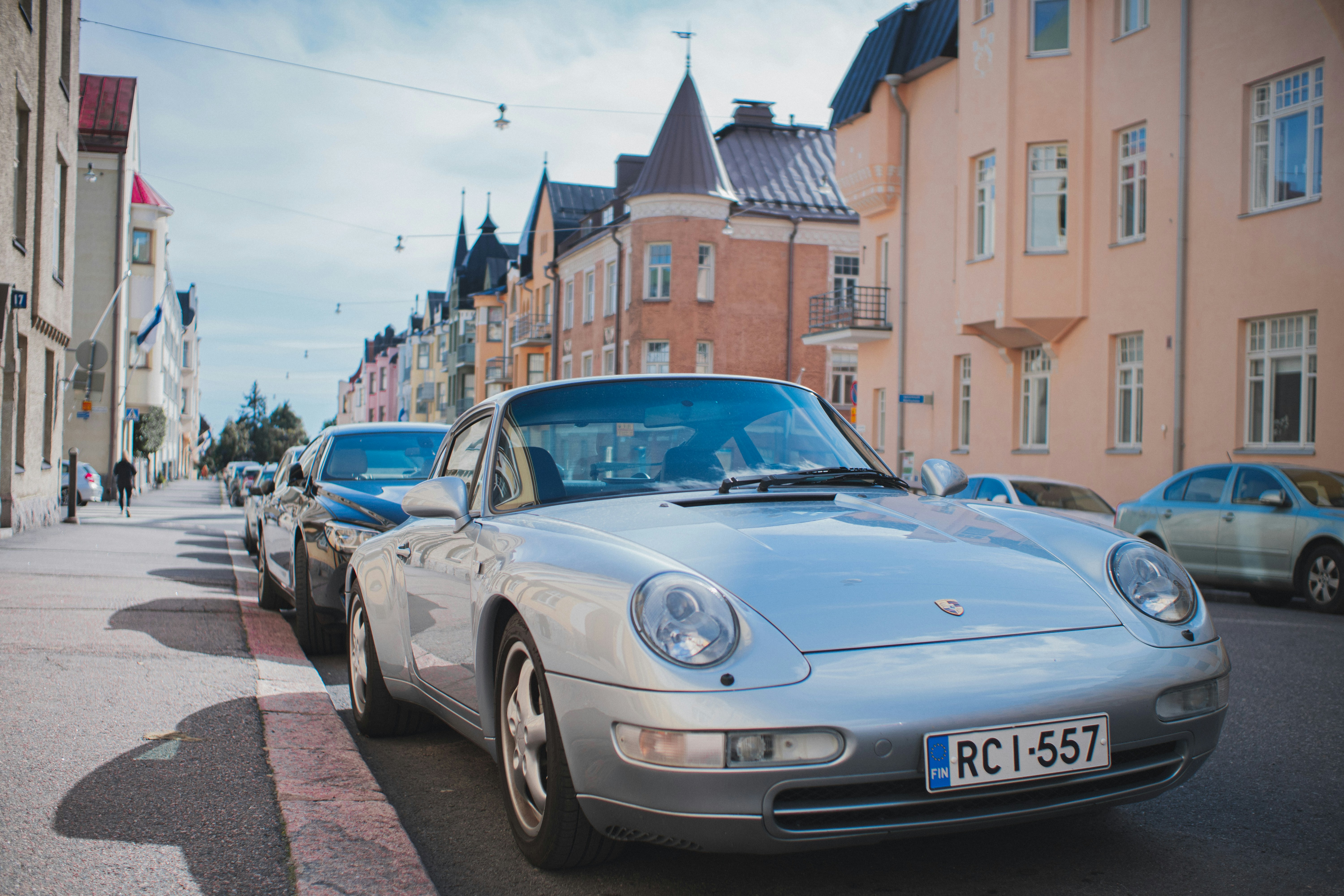 Silver Porsche 911 Anchored by a Pastel Nordic Street