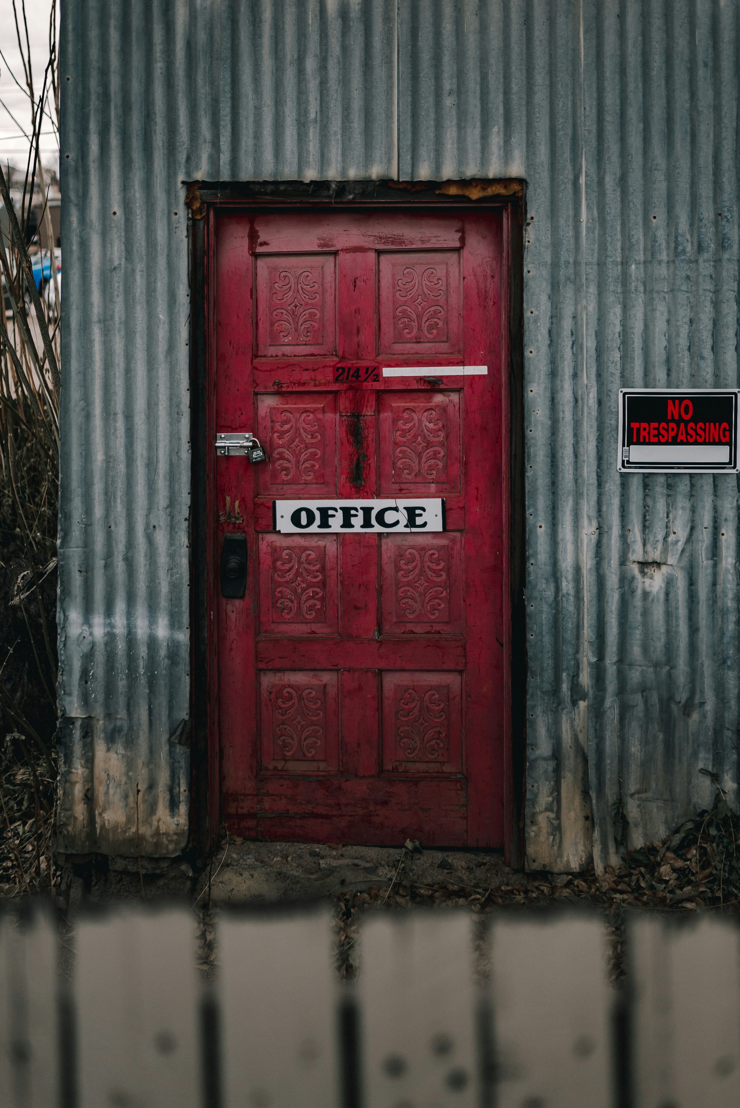 Red wooden door with red and white signage photo – Free Building Image ...
